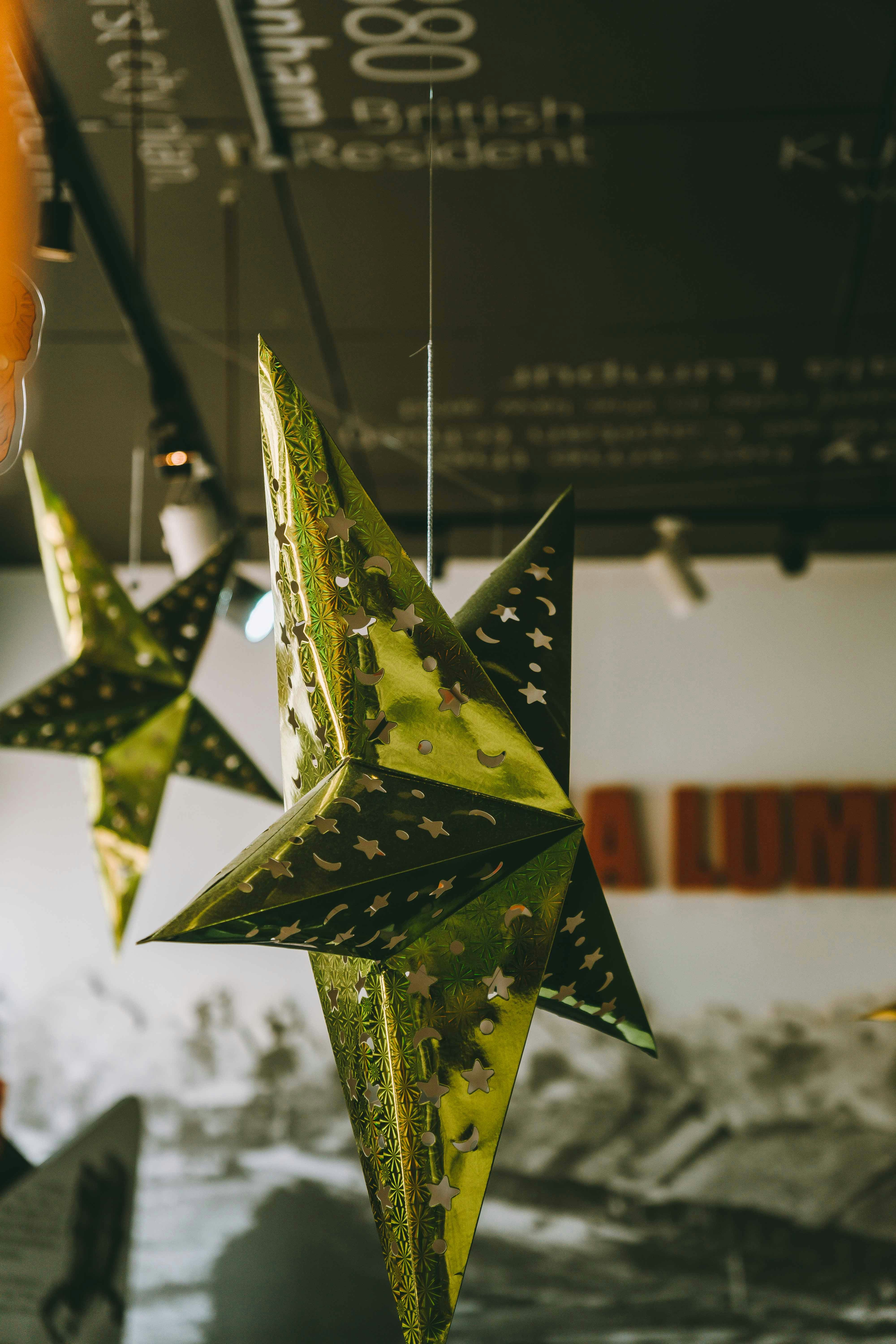 Emerald Origami Star in a Quiet Gallery