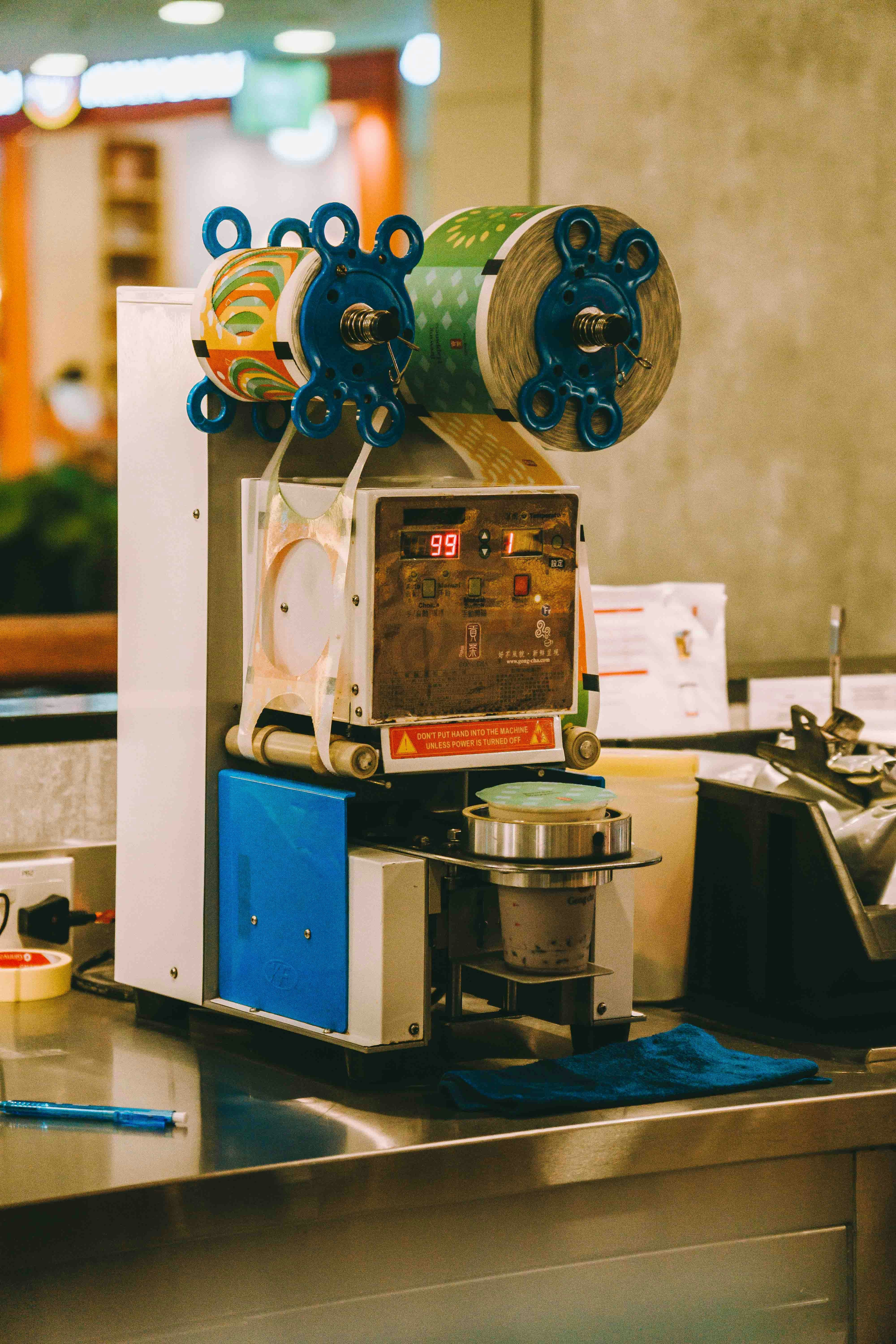 Coiled Spools and a Metallic Counter: A Café’s Quiet Mechanical Corner