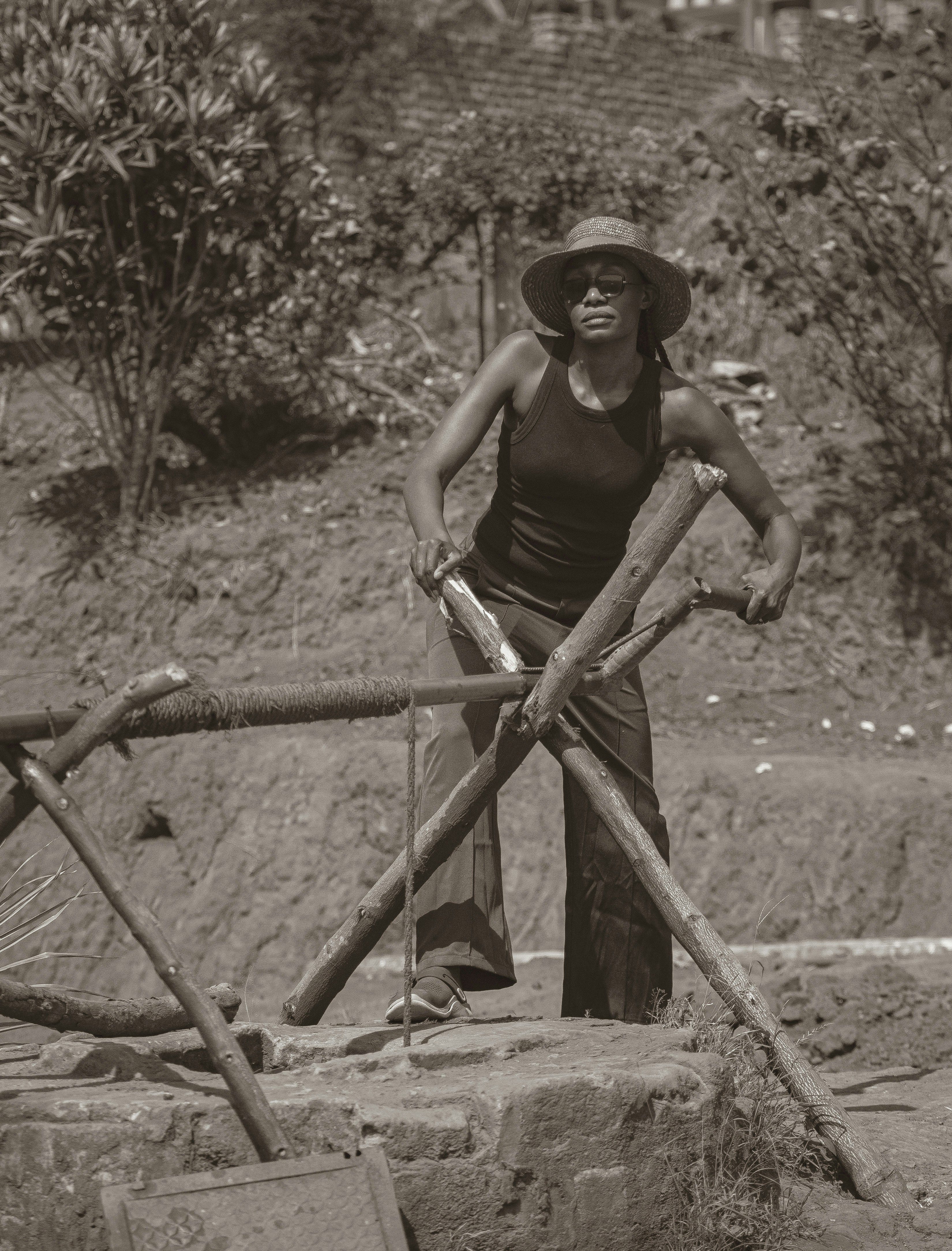 Straw-Hatted Poise on a Rustic Fence