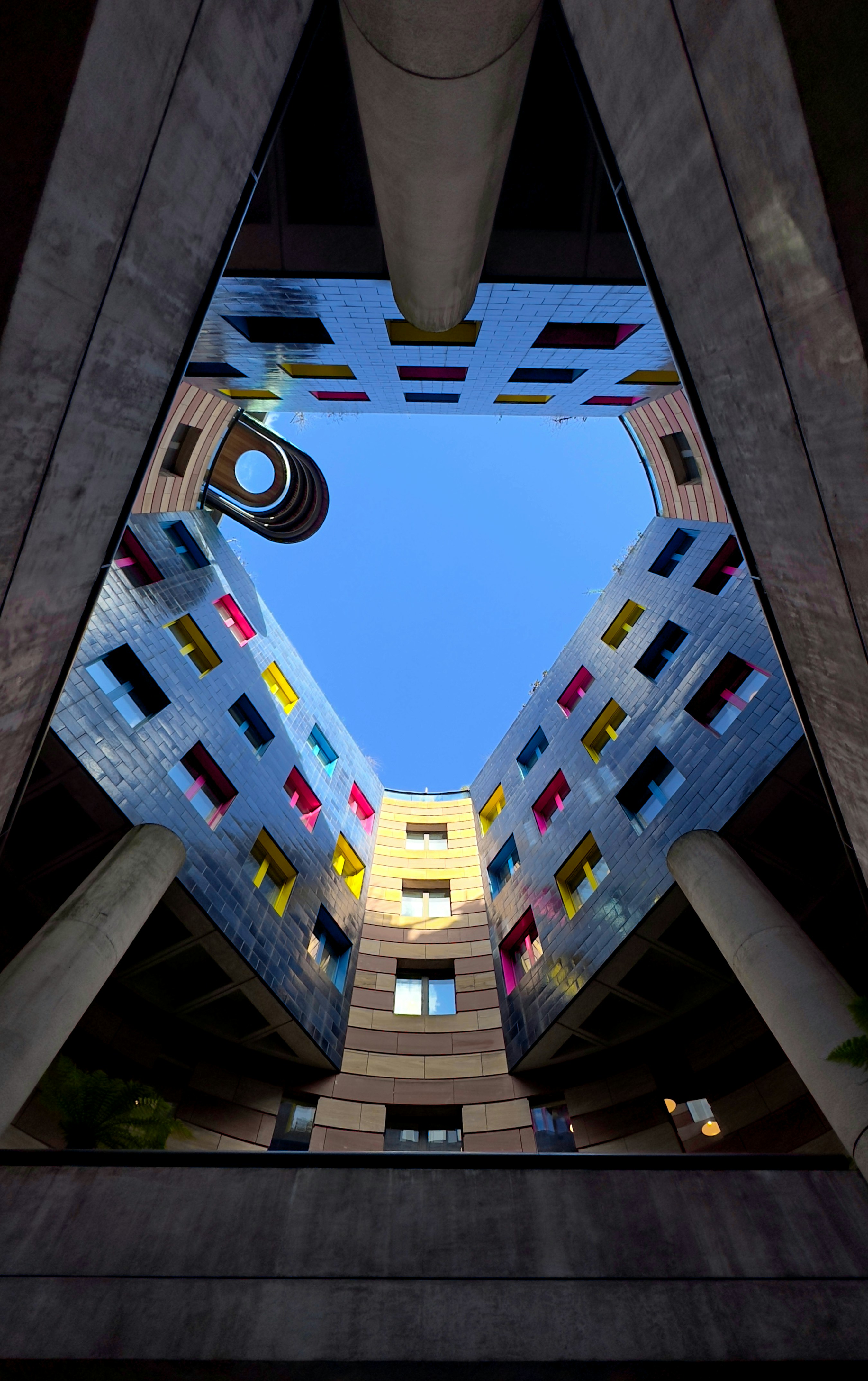 Atrium of Color: Sky Framed by a Concrete Vignette