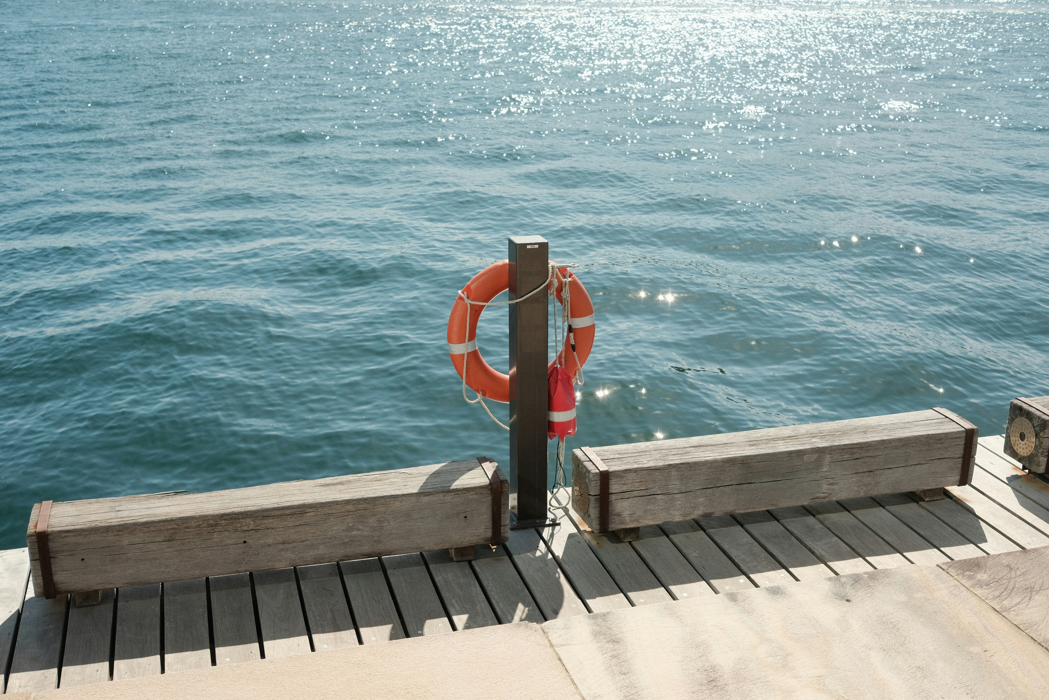 A boat dock with a life preserver and a life preserver photo – Free Sea ...
