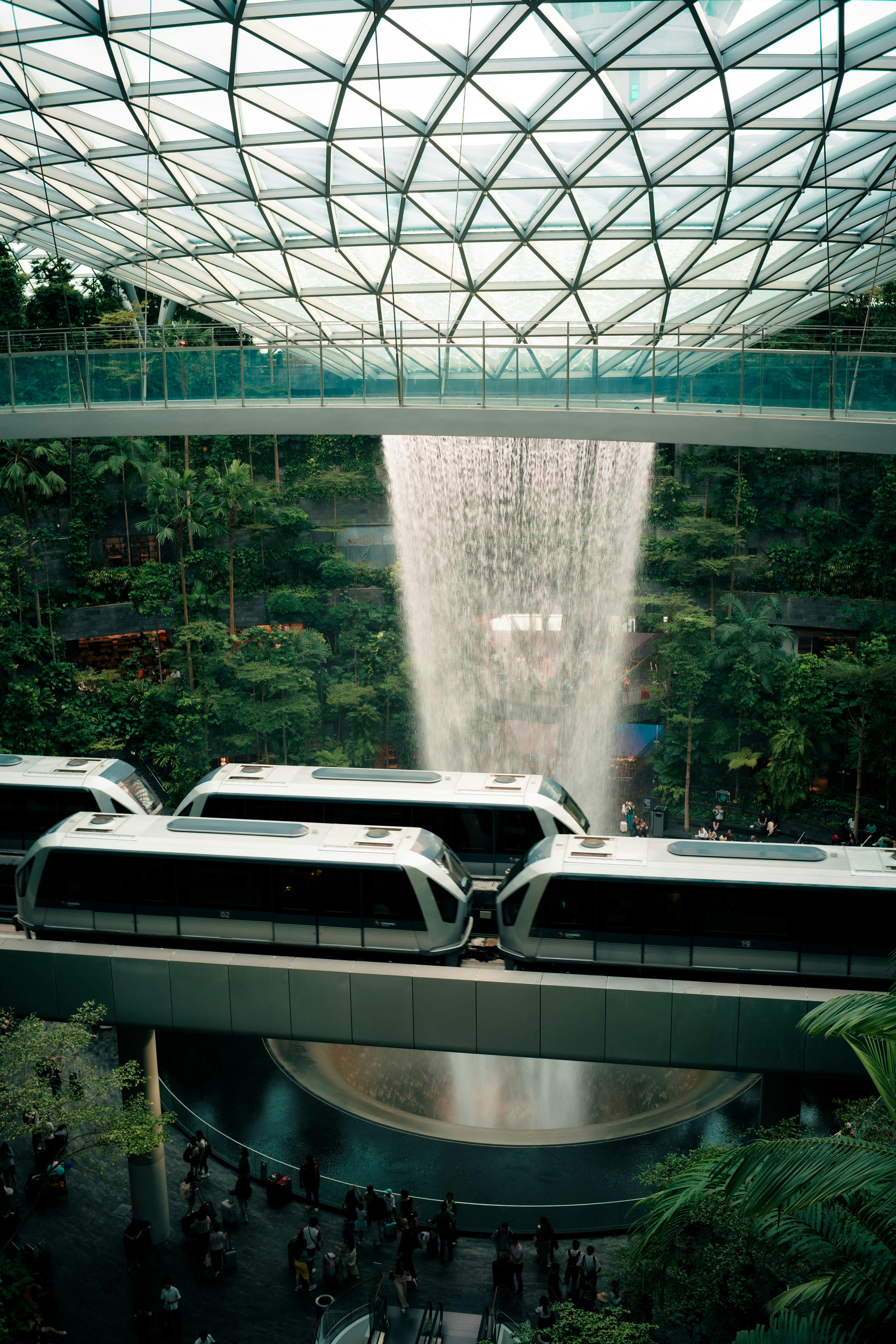 The airport boasts a large waterfall and train. photo – Free City Image ...
