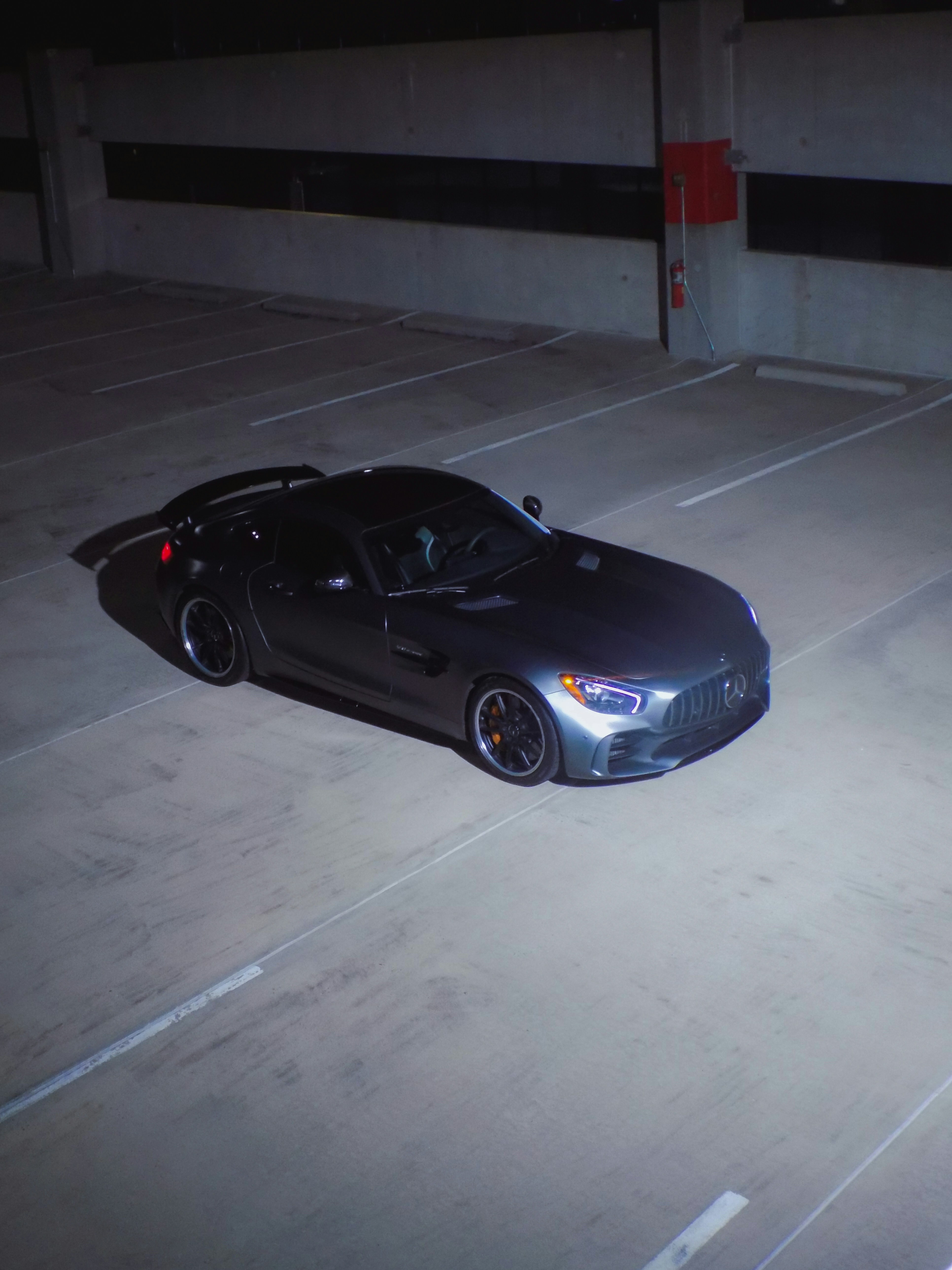 A sleek, black mercedes parked in a garage. photo – Free Car Image on ...