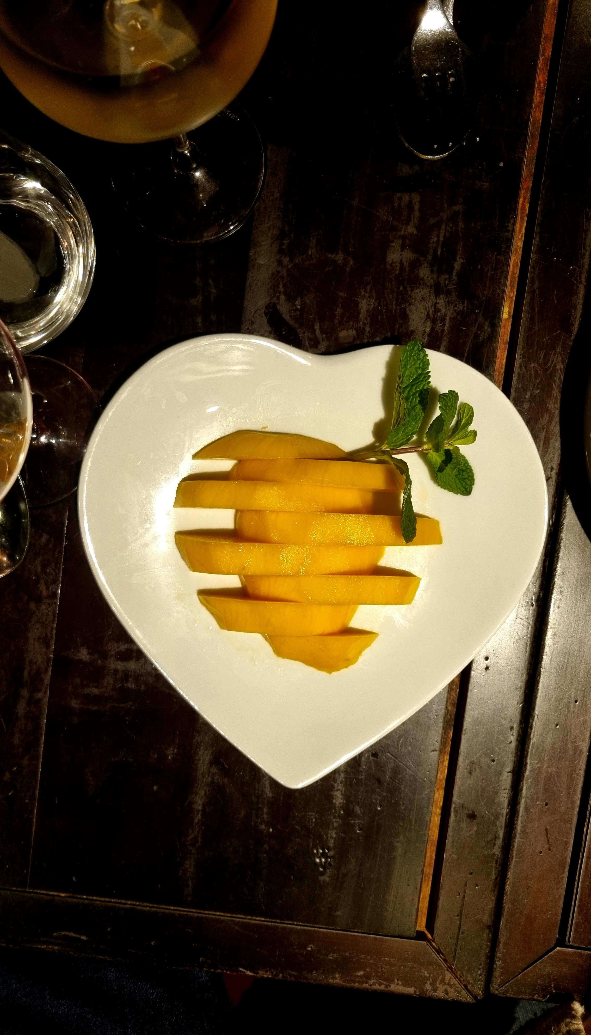 Mango Ribbons on a Heart: A Quiet Dinner Table Moment