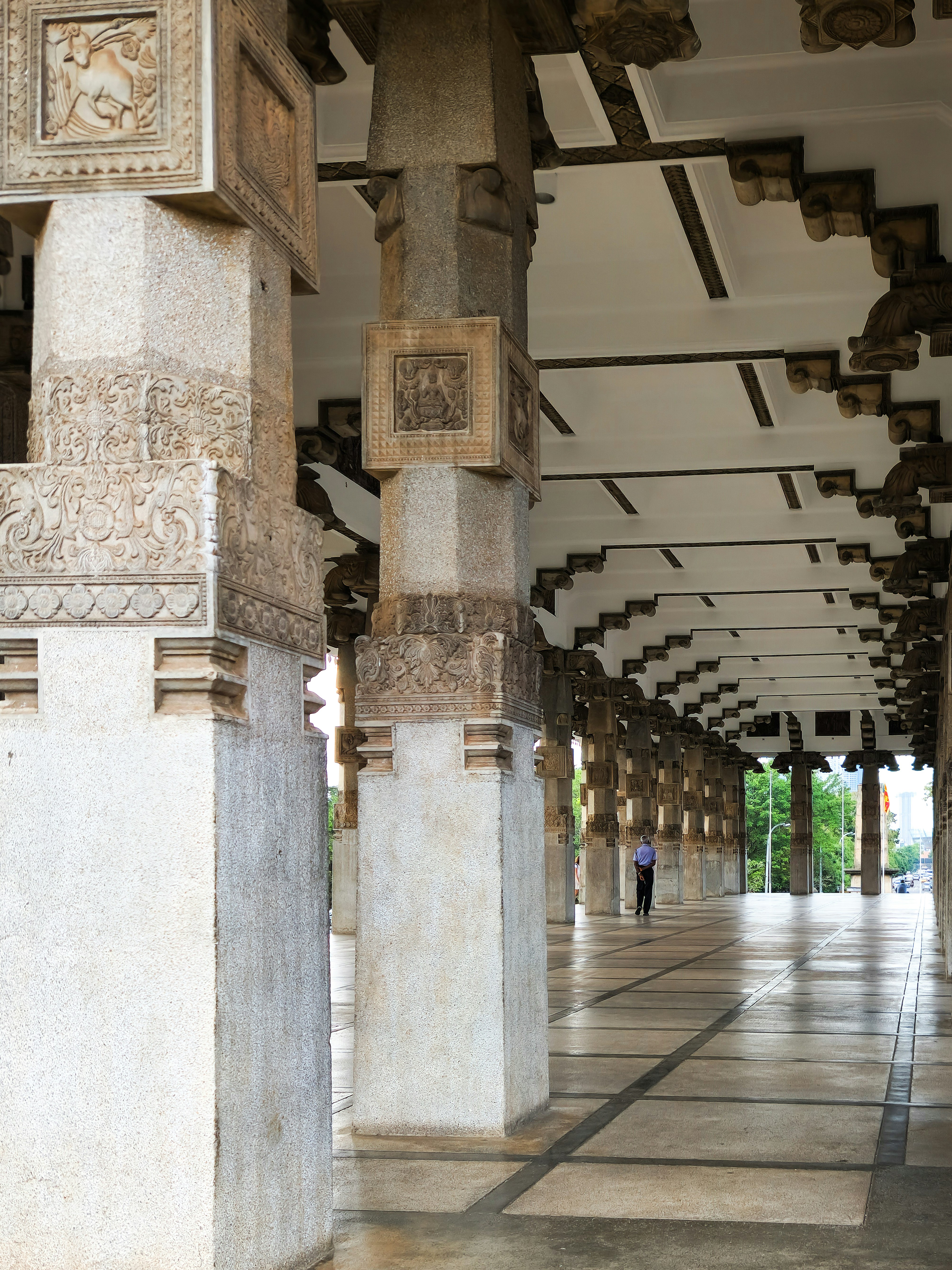 Ornate columns with intricate carvings line the interior of Independence Memorial Hall in Colombo.