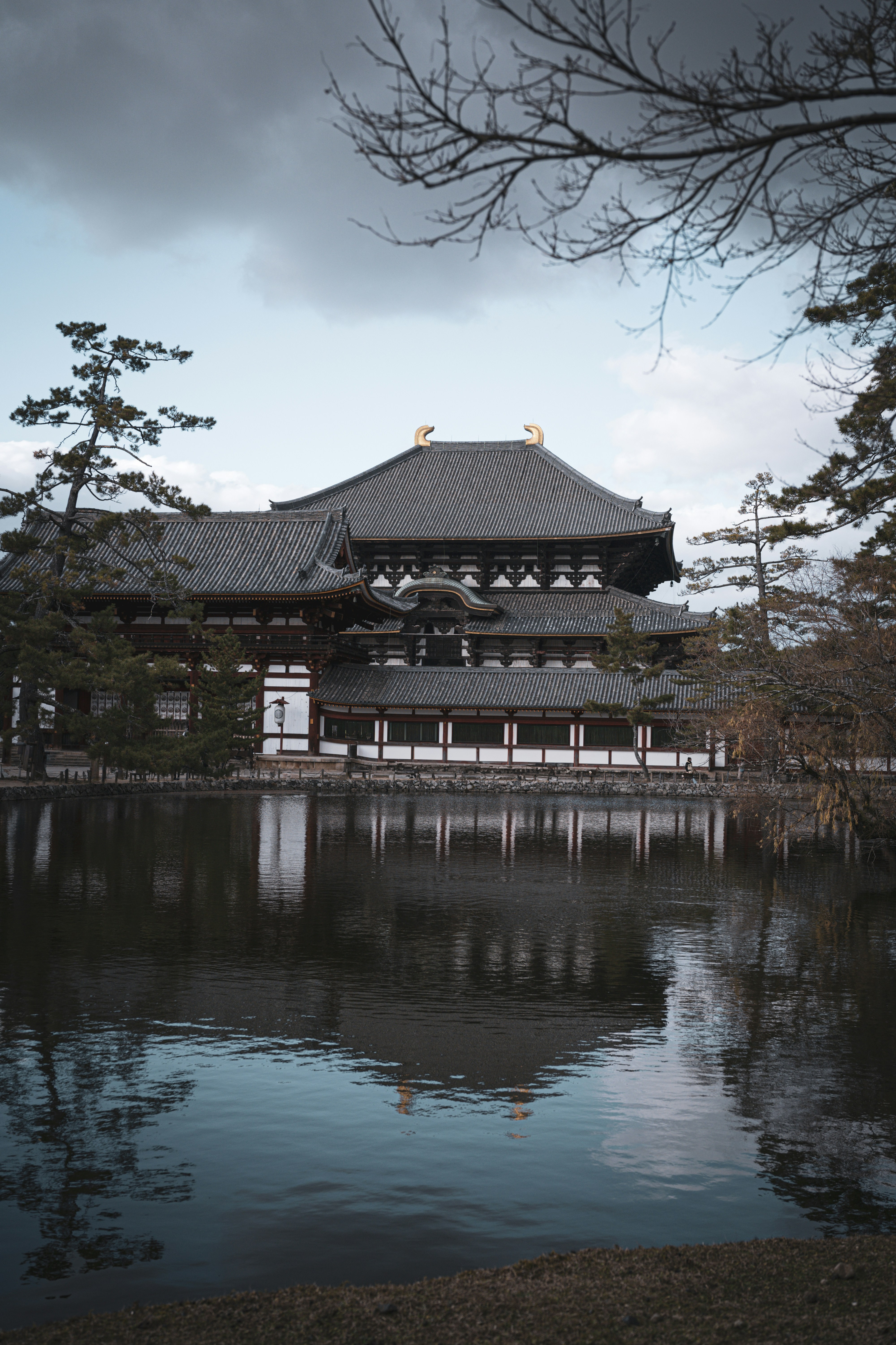 A japanese temple reflecting in a calm lake. photo – Free Building ...