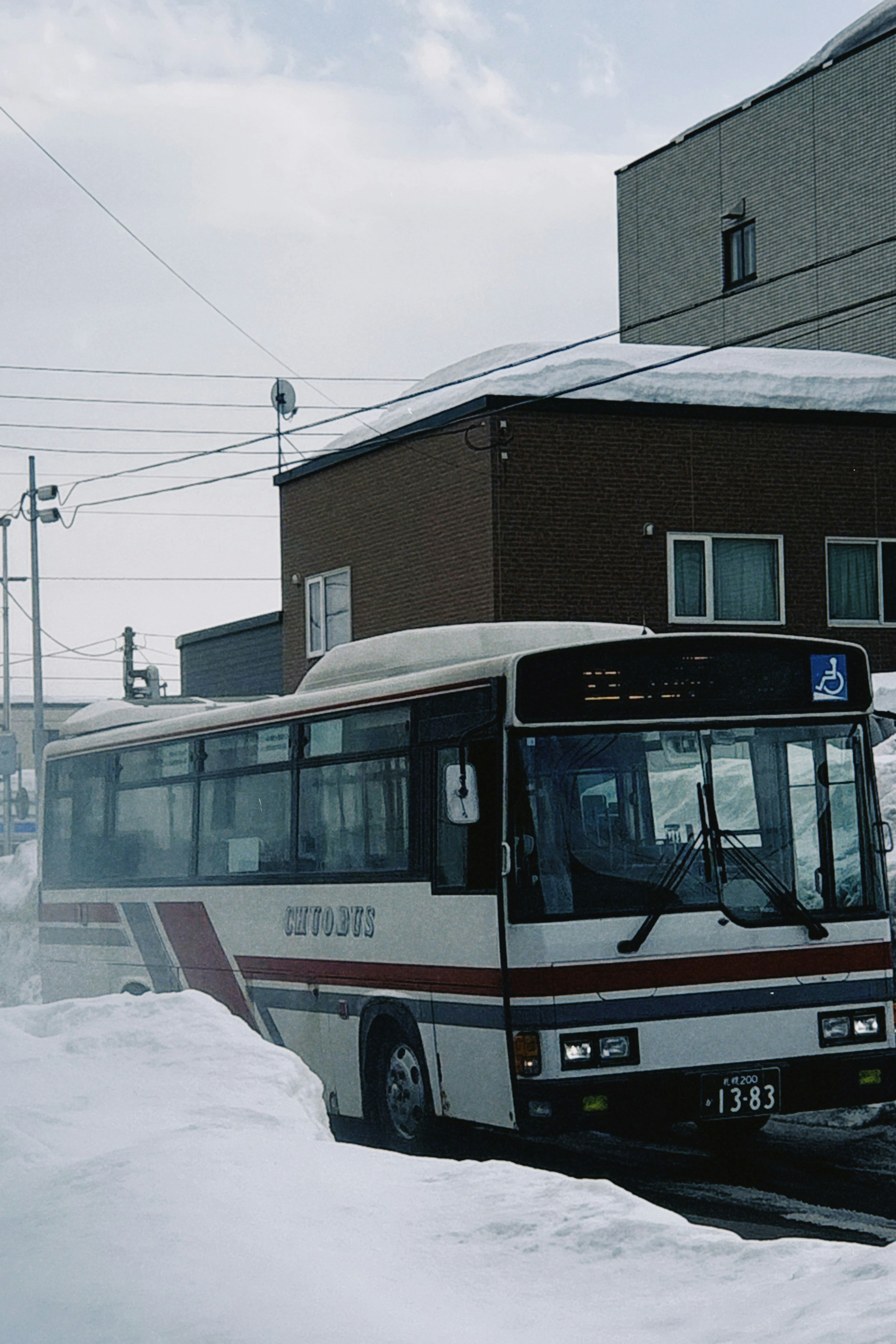 Winter Transit: A Bus in the Snowy Landscape
