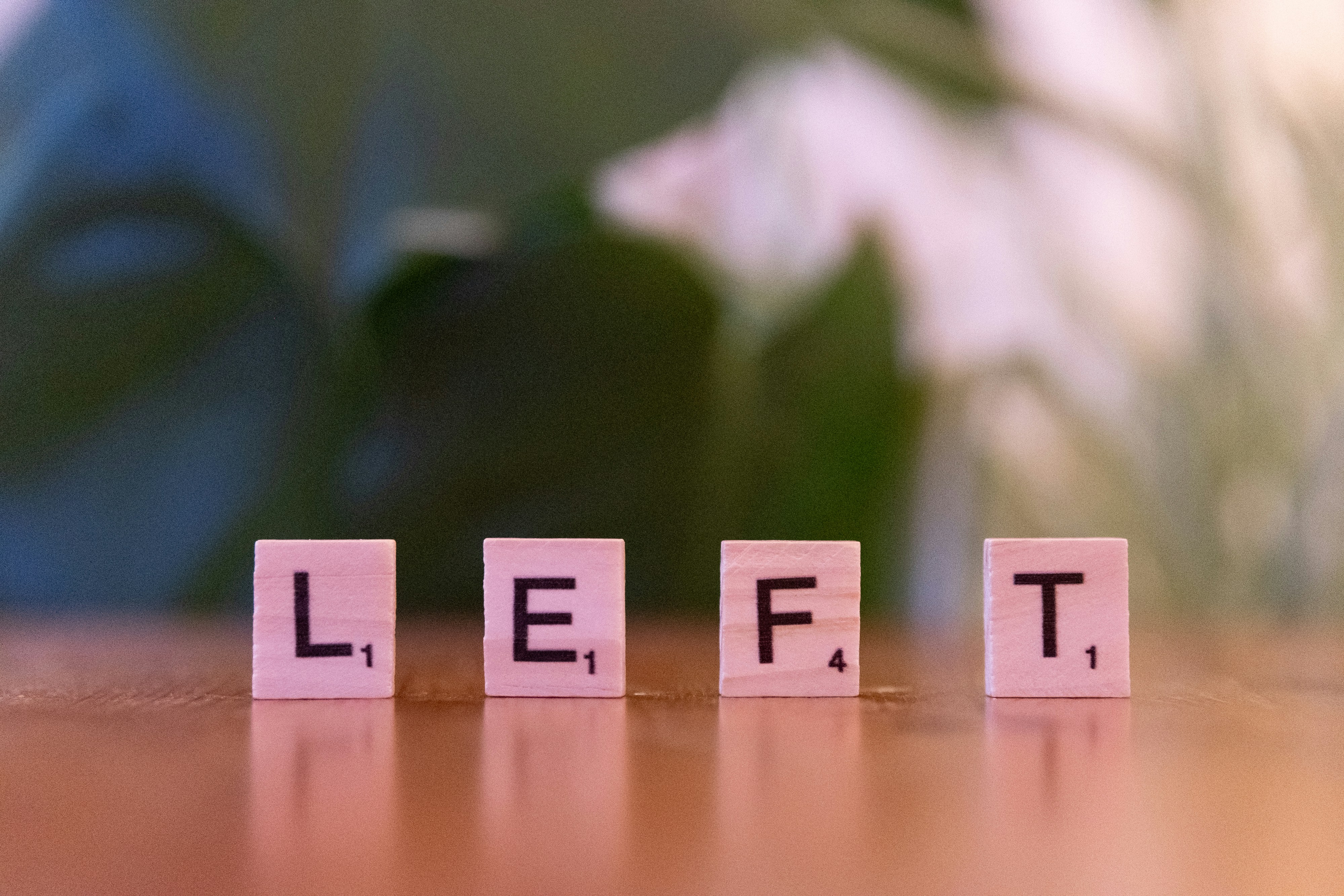 A wooden block spelling the word left on a table photo – Free Text ...