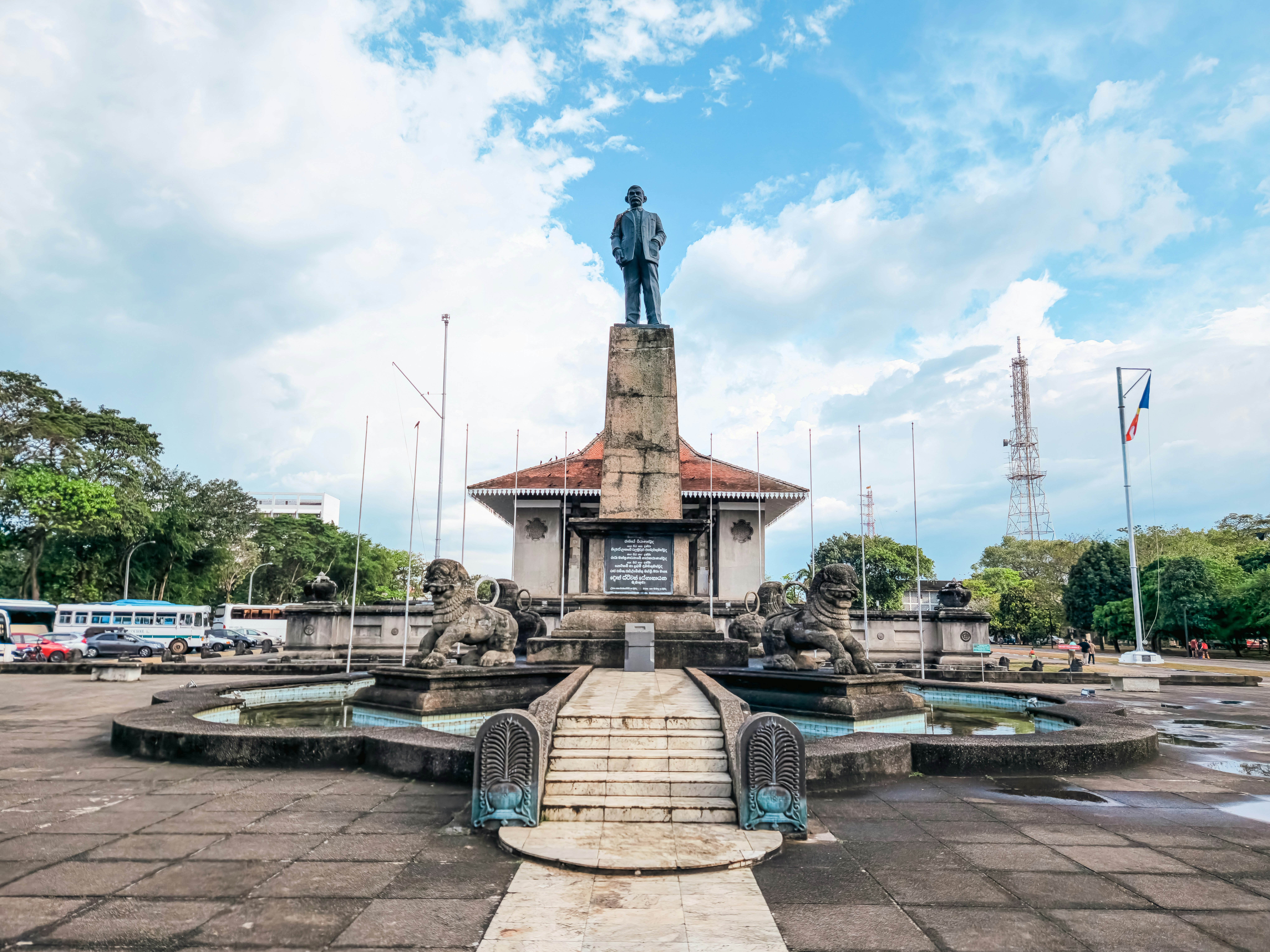 Statue of D.S. Senanayake at Independence Square, Colombo, with the Independence Memorial Hall and guardian stone lions.