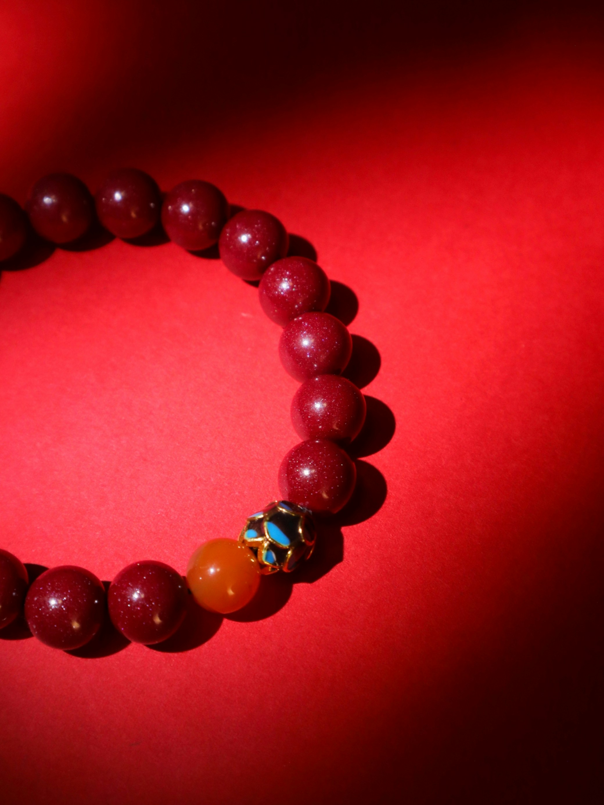 Vibrant Harmony: Beads in Scarlet Light