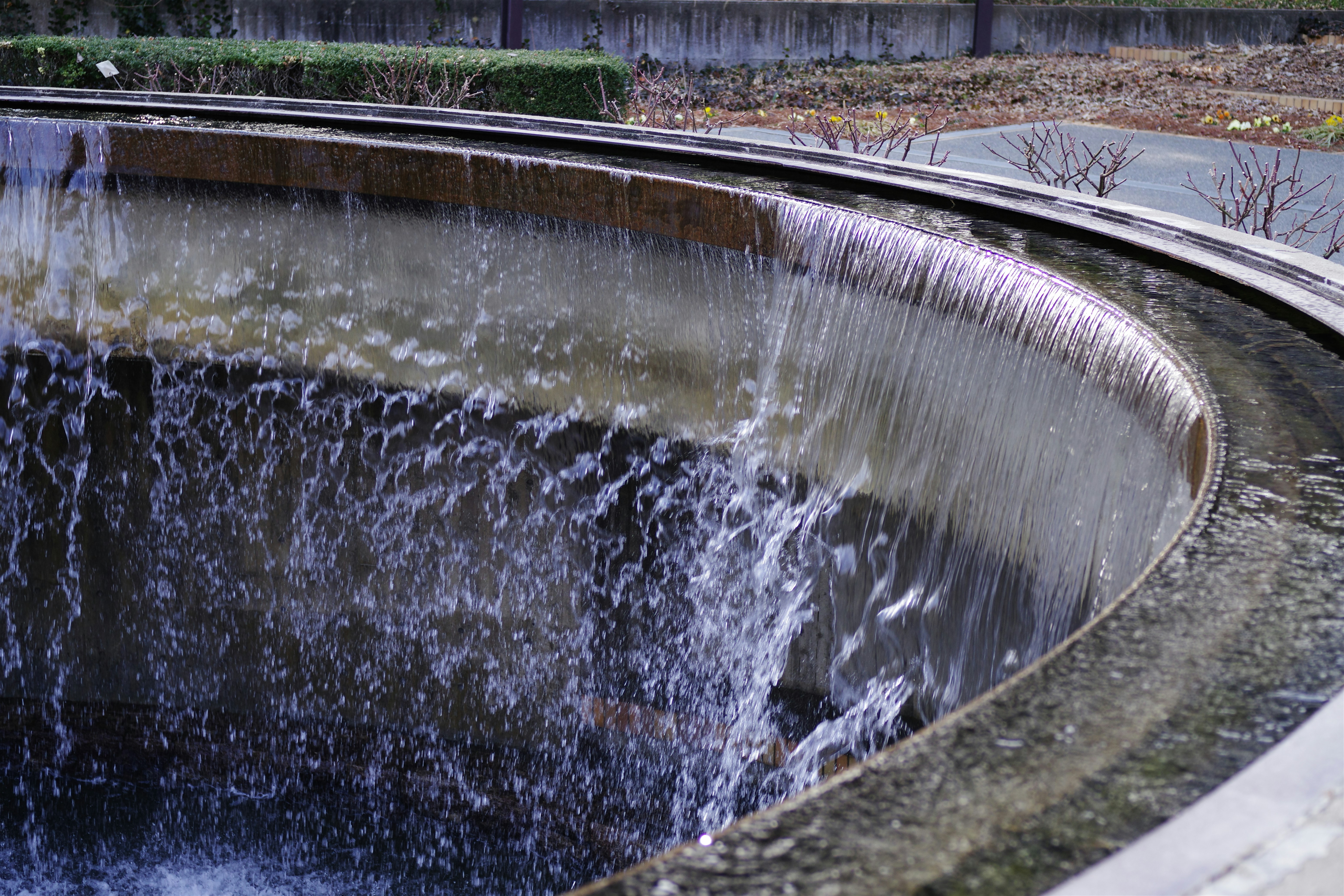 Water cascades over the edge of a fountain. photo – Free Outdoors Image ...