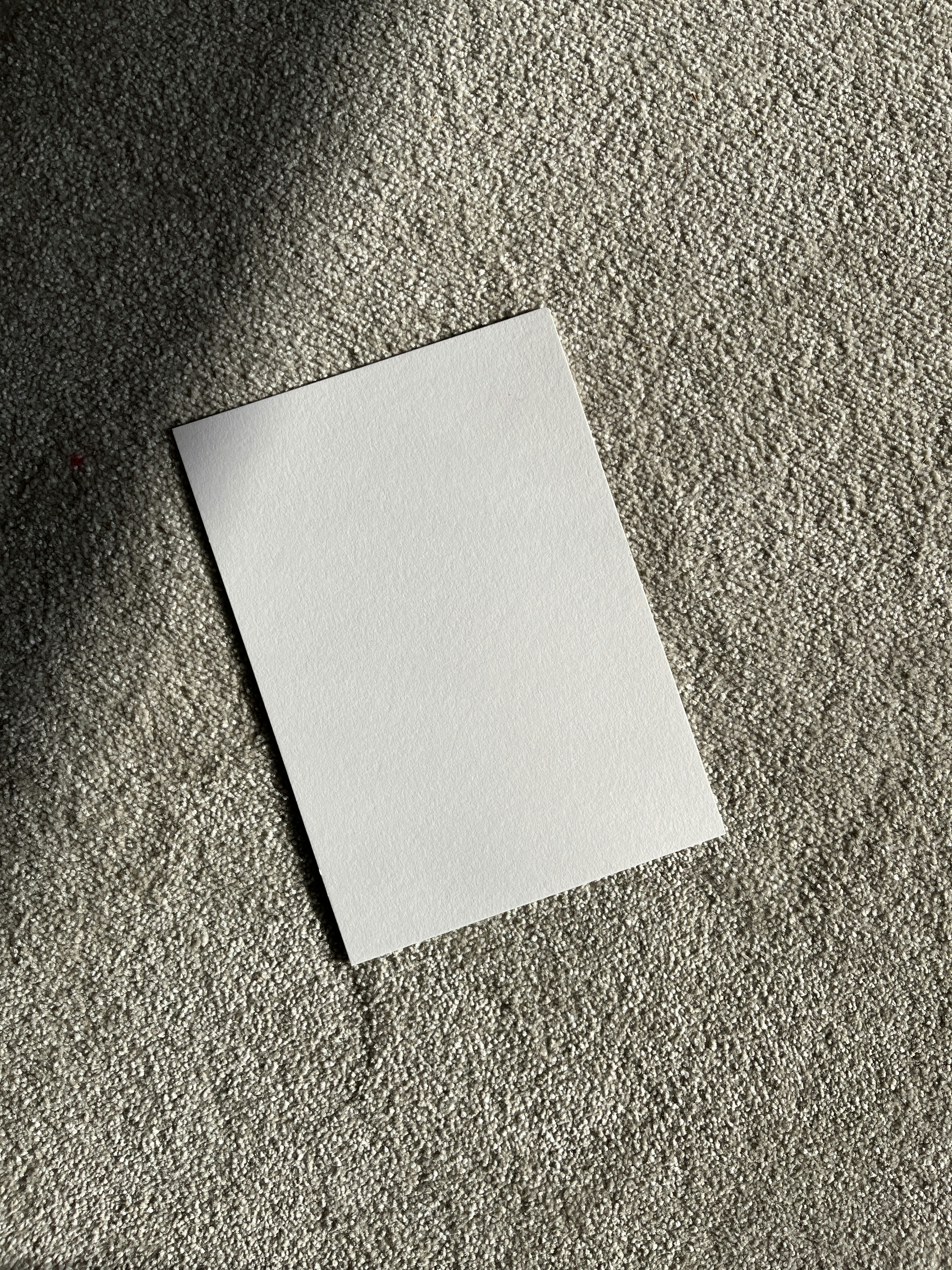 A blank white paper on a textured surface. photo – Free Paper Image on ...