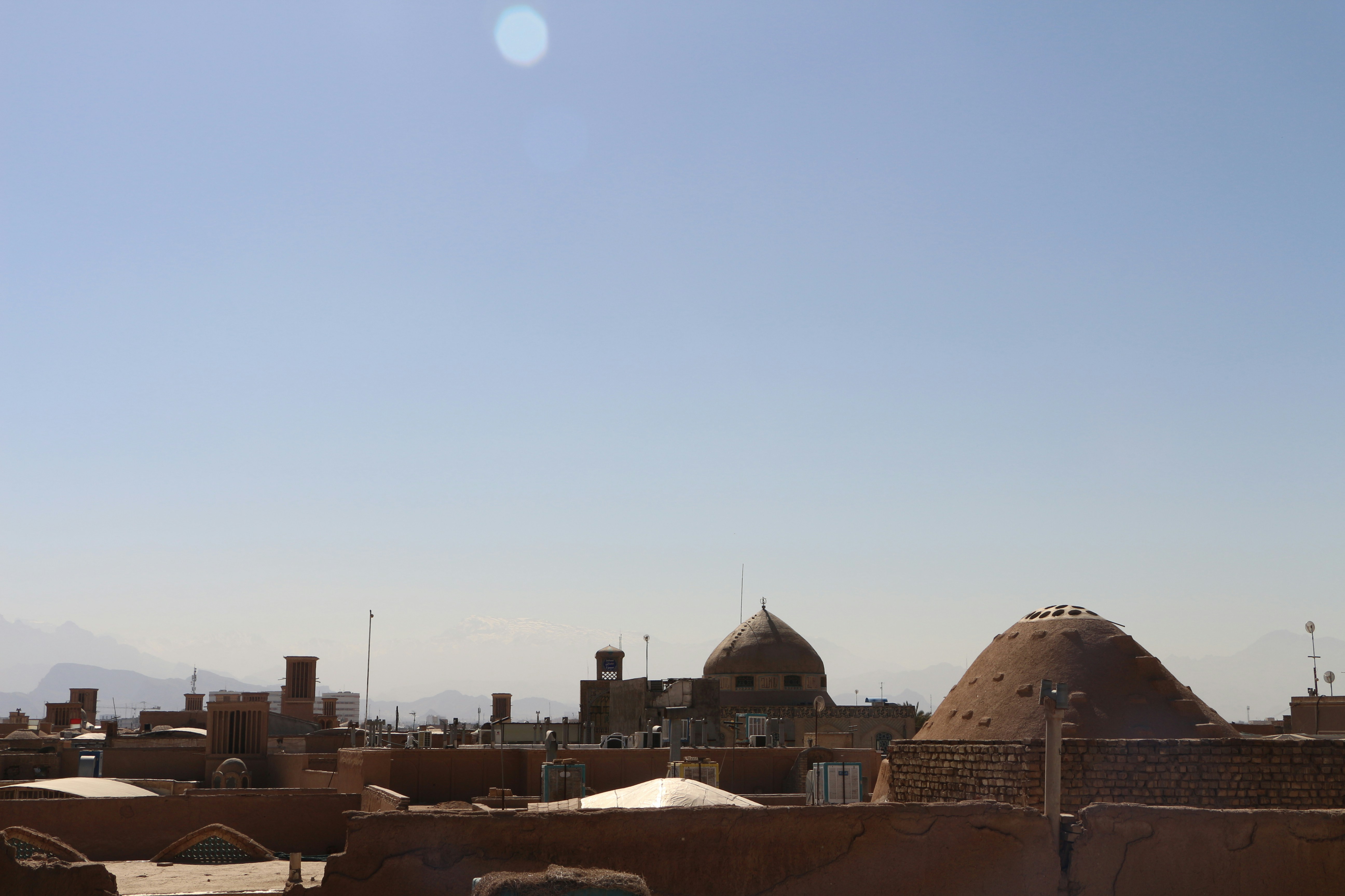 Dome Skyline Over Sunlit Mud-Brick Rooftops