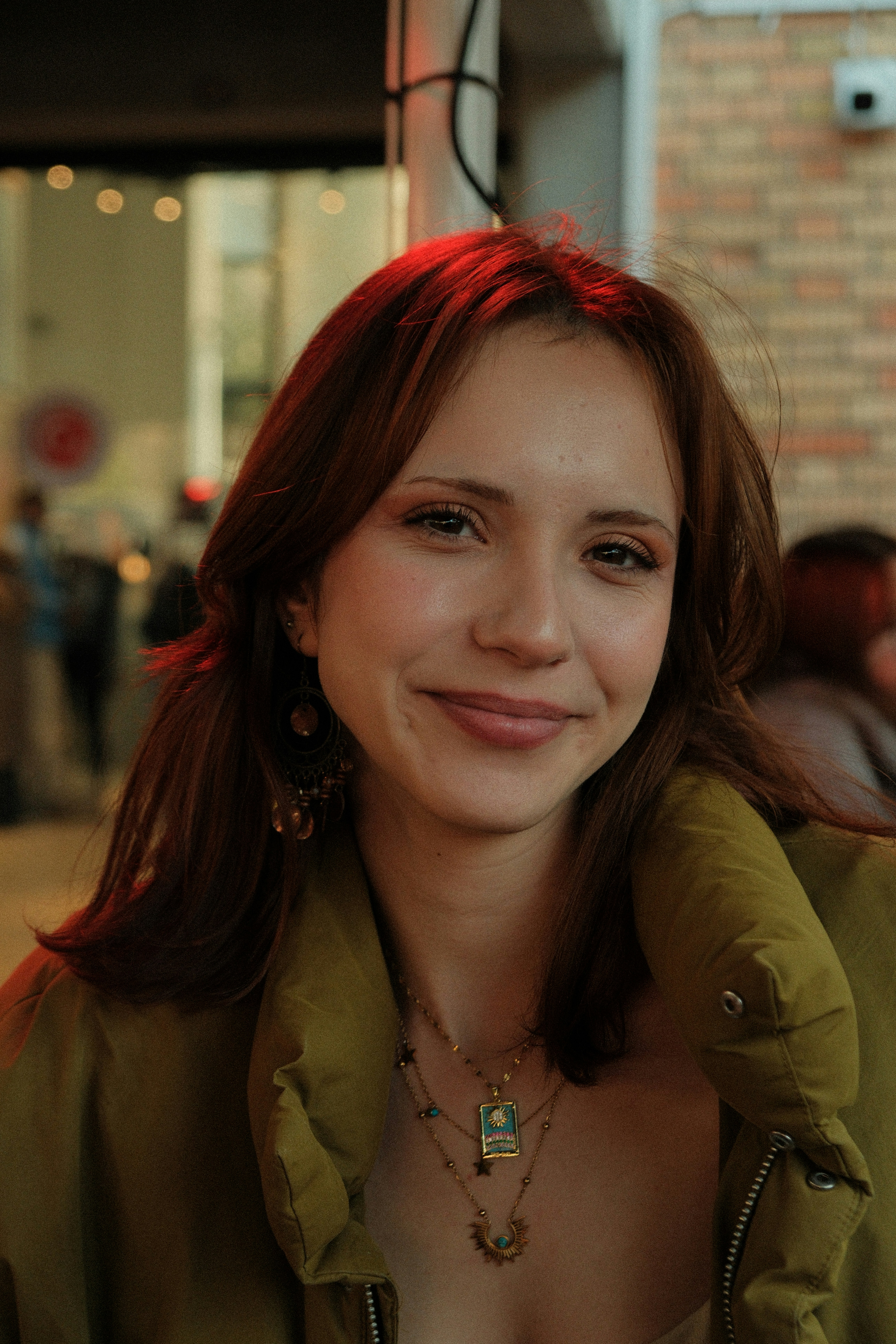 Evening Warmth Under Neon: A Close-Up Portrait in Soft City Light