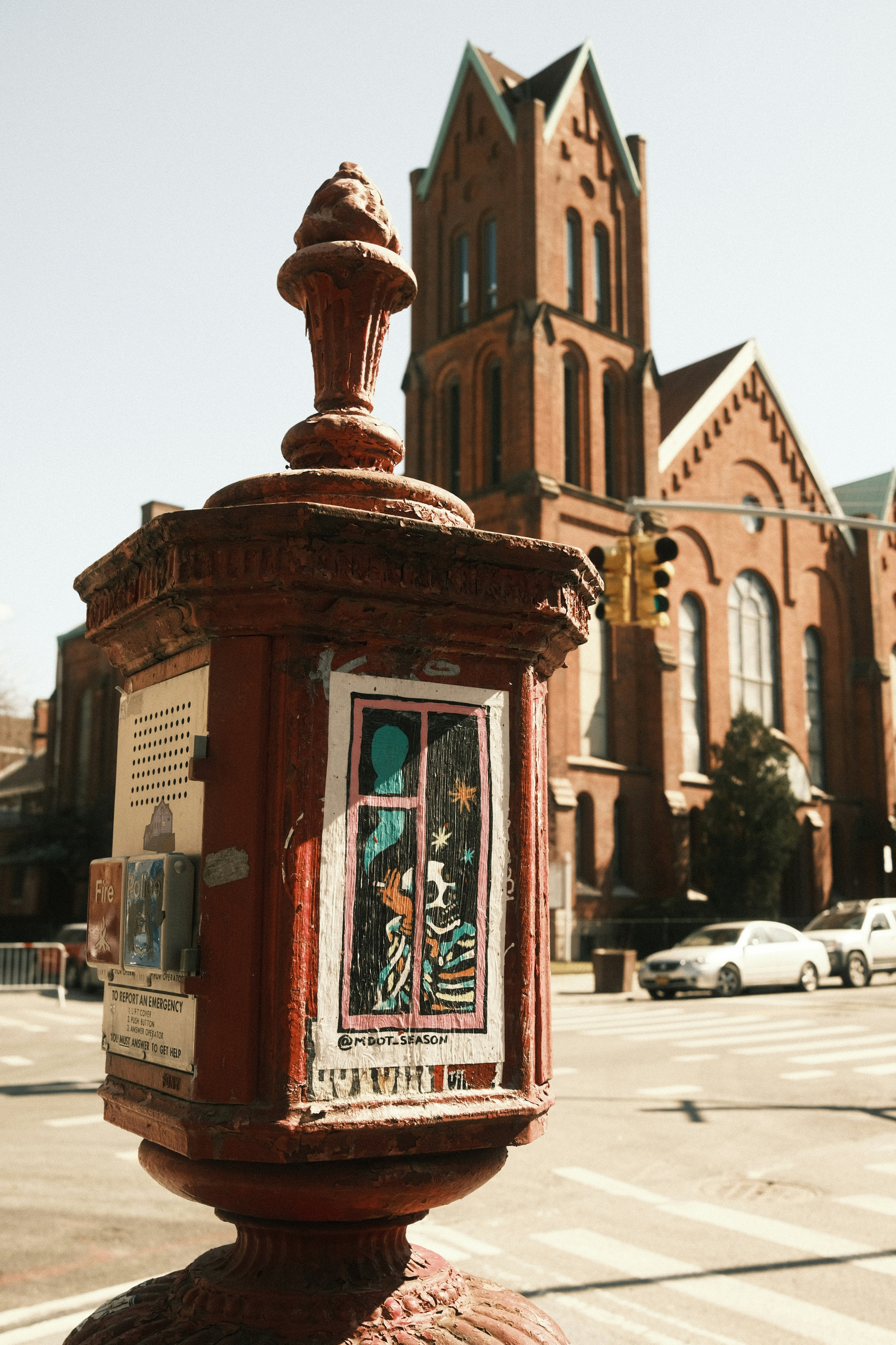 Crimson Street Lantern Framing a Gothic Church