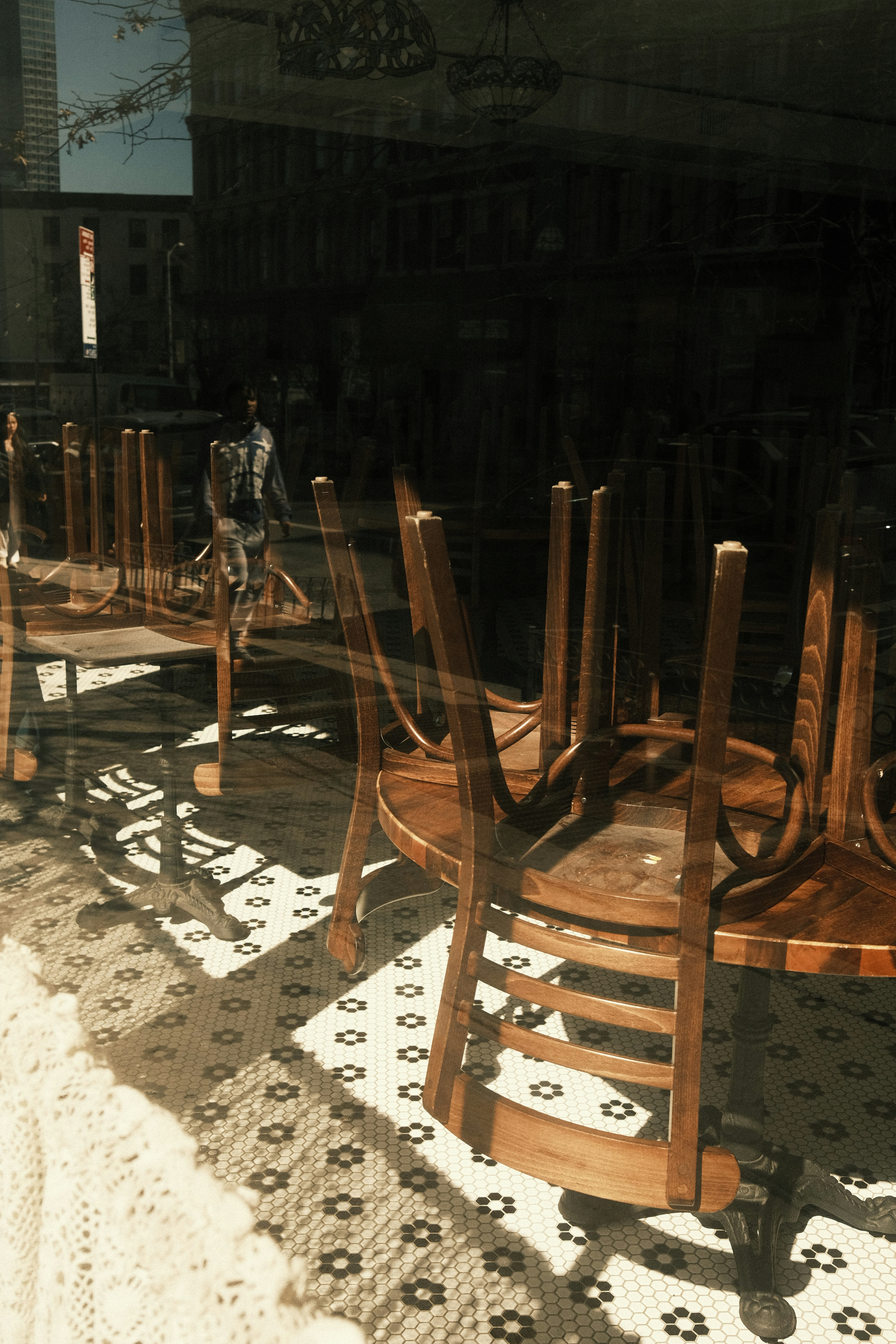 Glassbound Café: Stacked Chairs and the Street Beyond