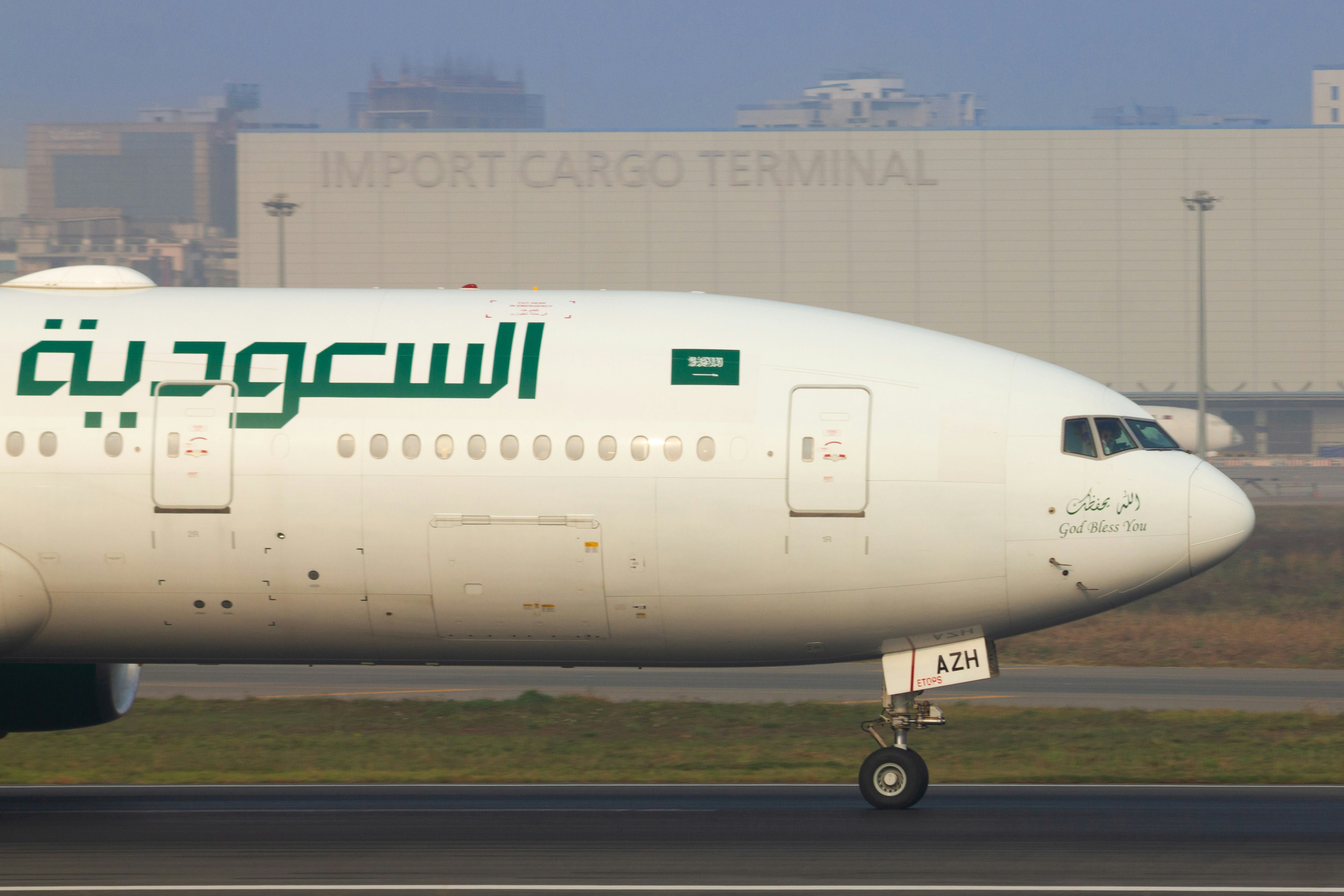 Saudi arabian airlines airplane taxiing on the runway. photo – Free ...