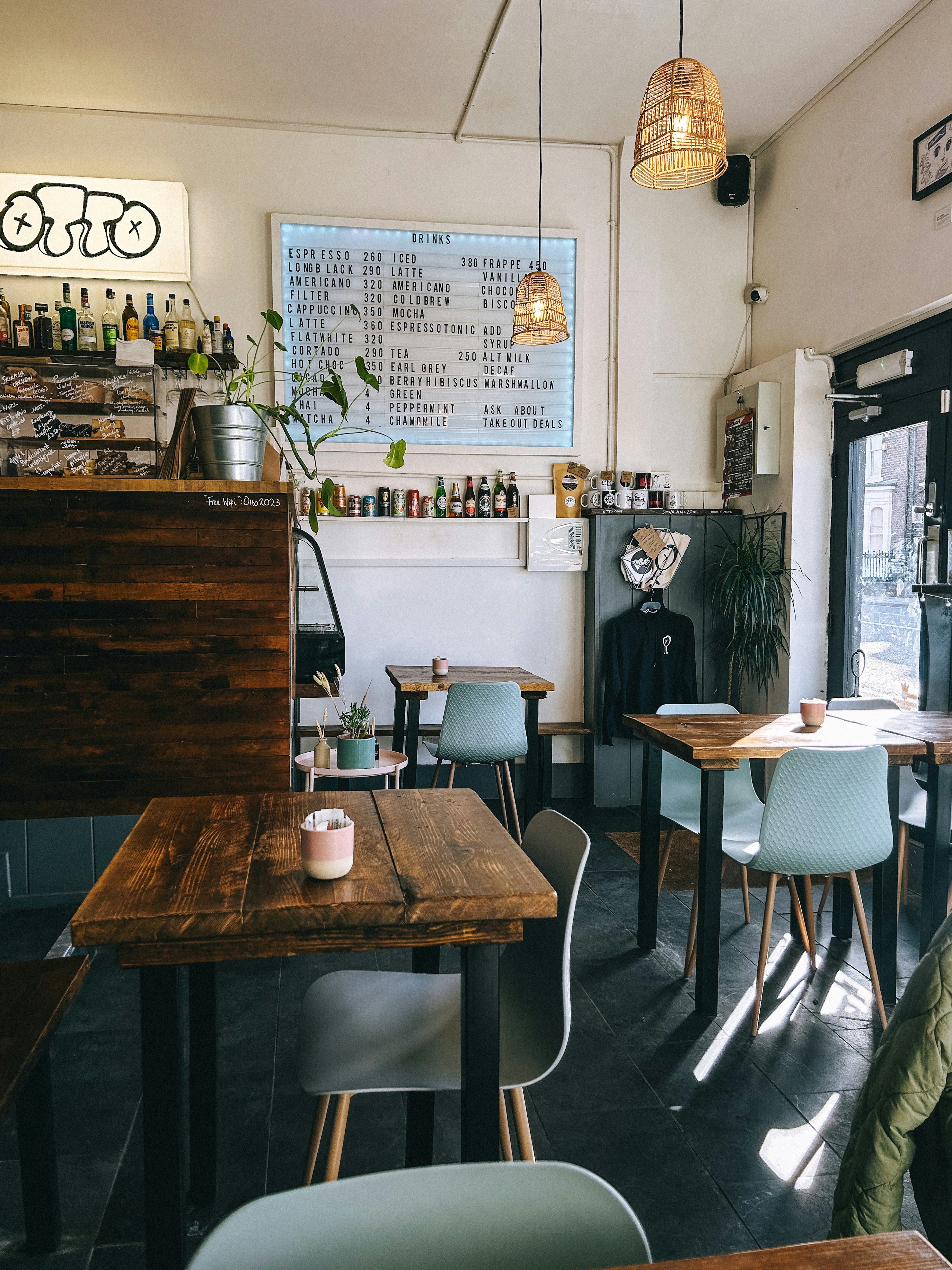 A restaurant with tables, chairs, and a counter photo – Free Man Image ...
