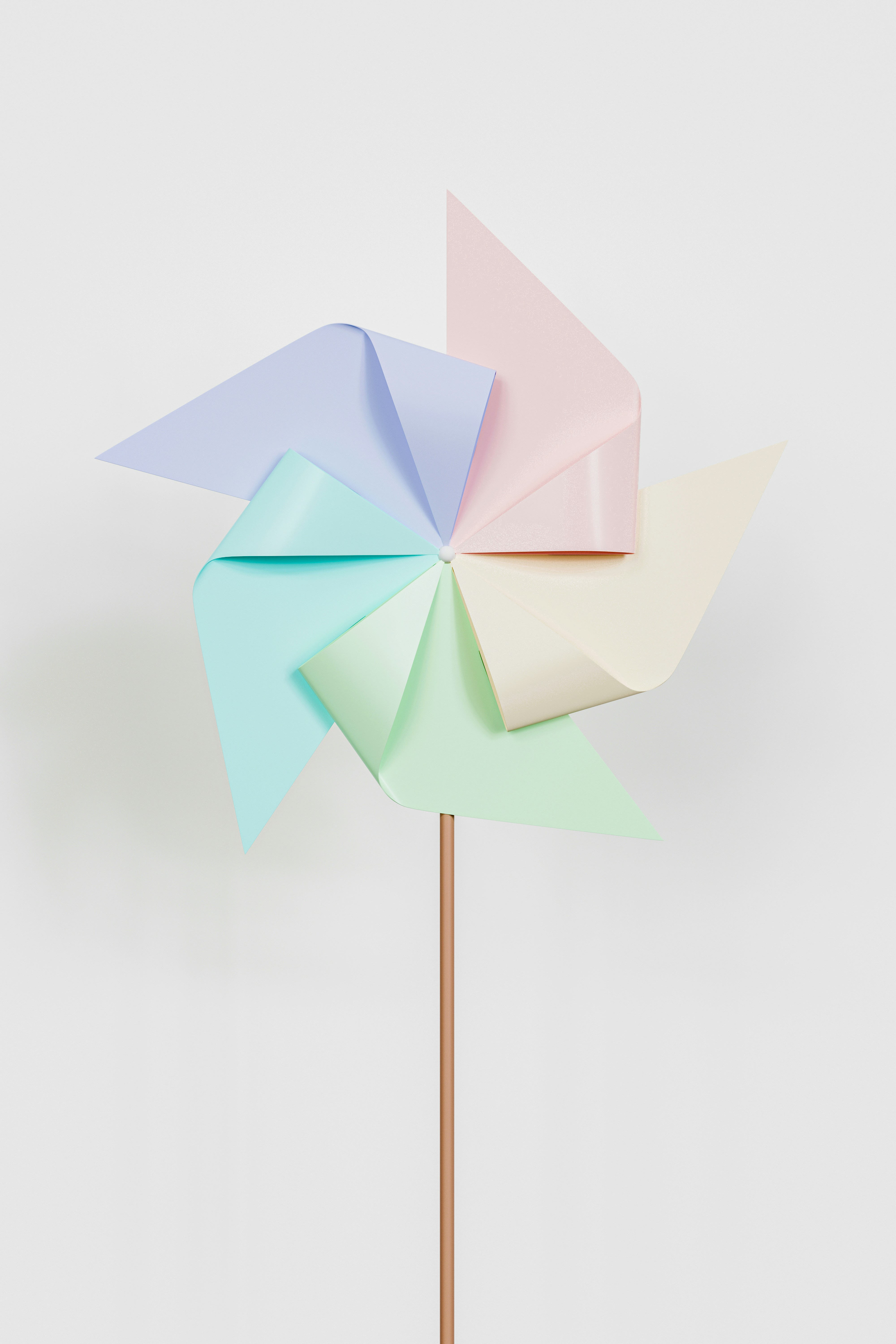 A paper pinwheel on a wooden stick photo – Free Wallpaper Image on Unsplash