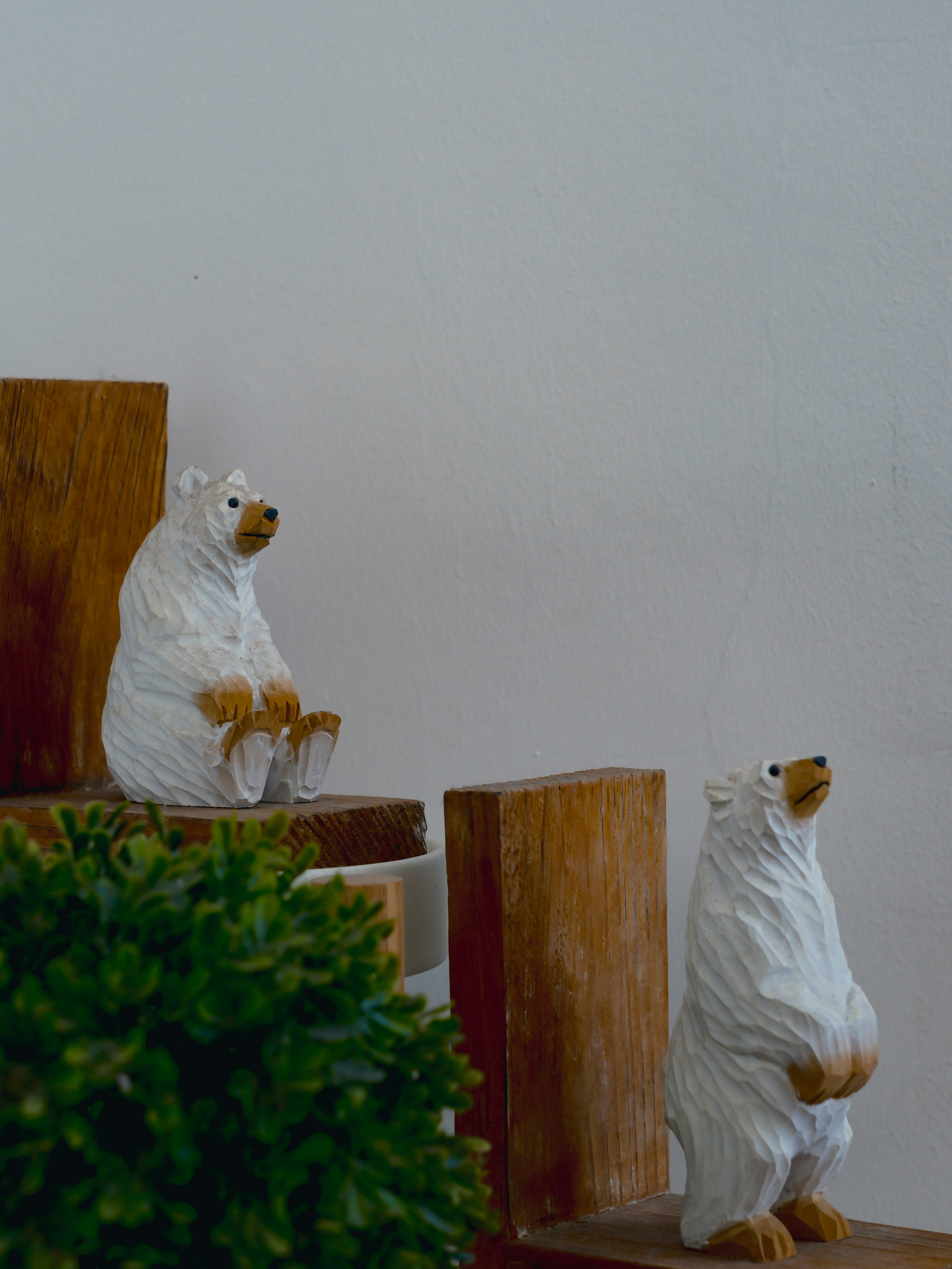 Whimsy on Wood: Polar Bear Sentinels Beside a Pale Wall