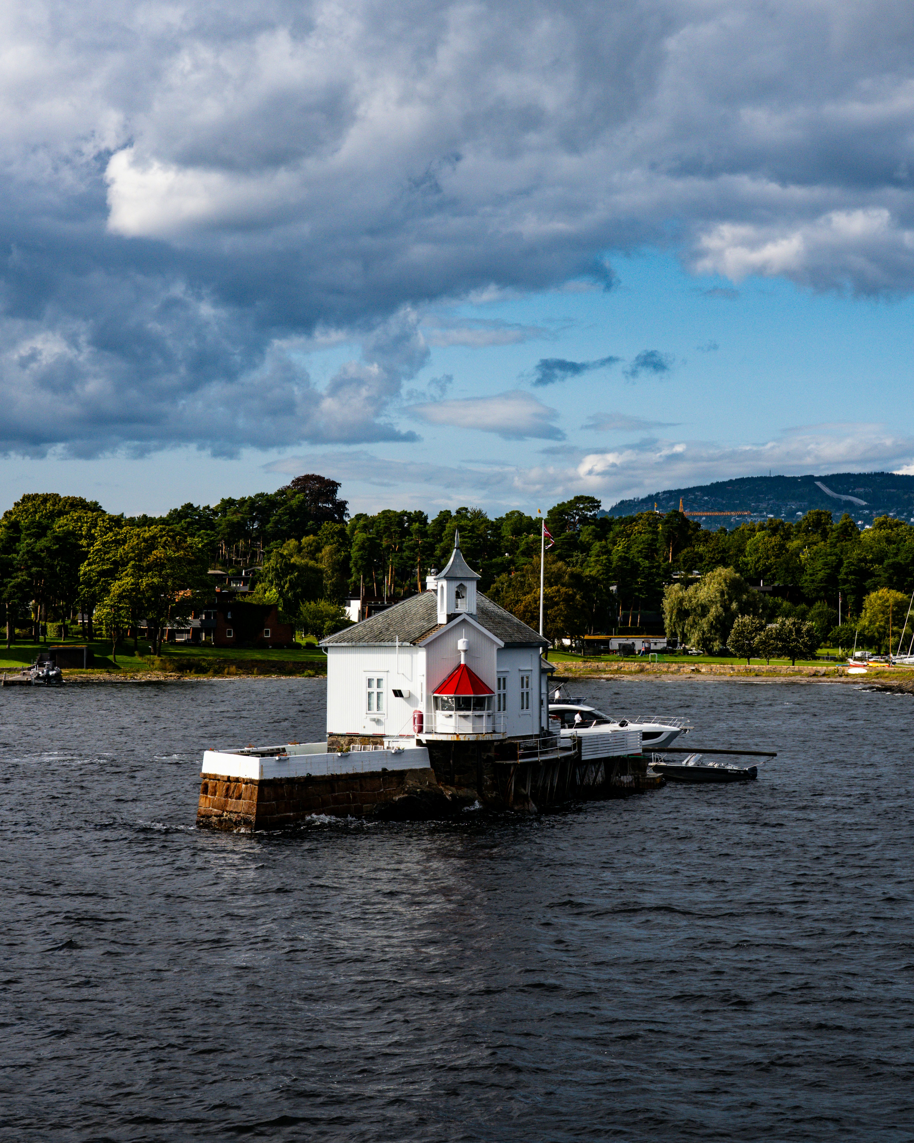 White Boathouse on a Quiet Lake Pier