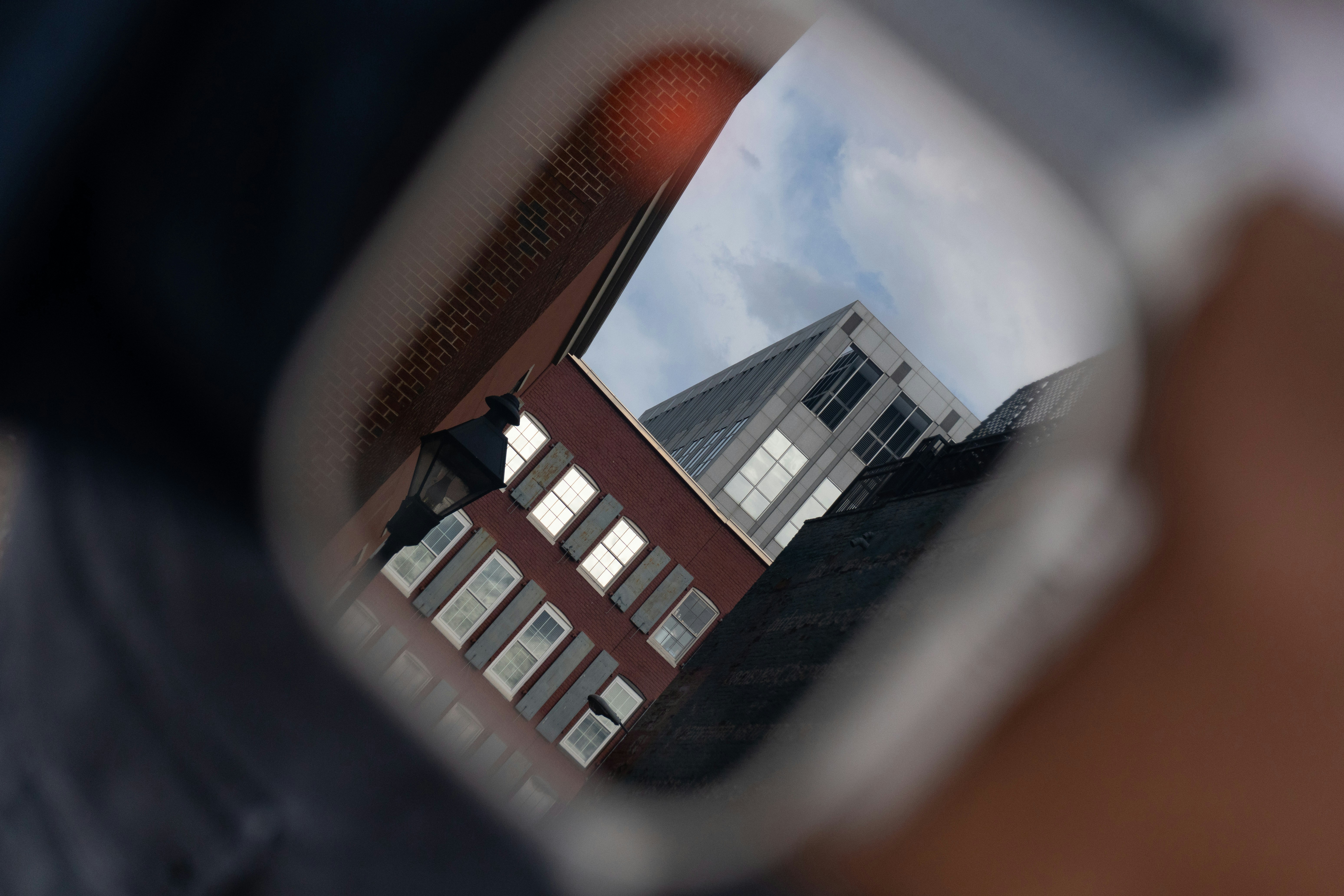 Through a Circular View: Urban Facade Framed in a Narrow Vignette