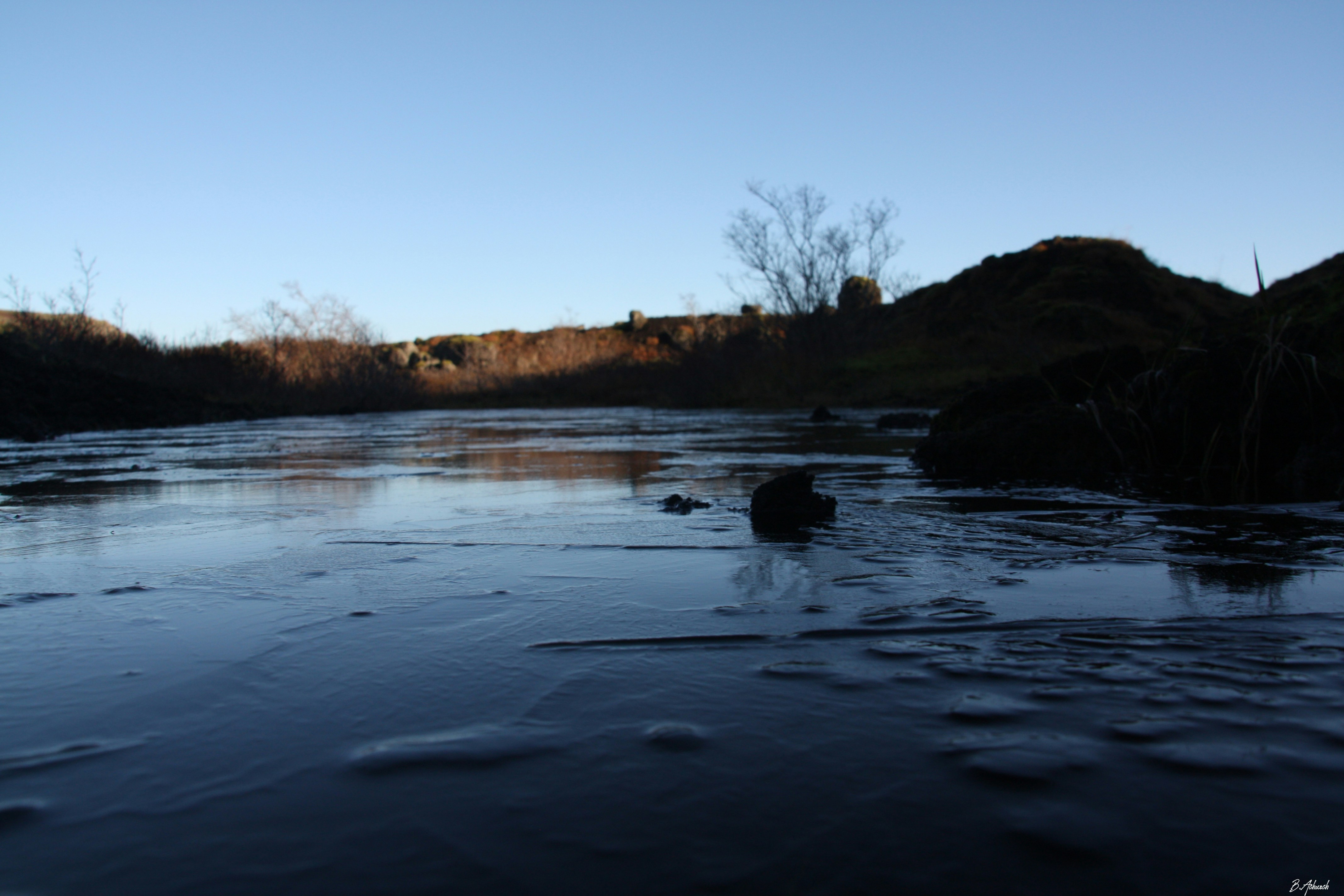 Whisper of Winter on the Riverbank