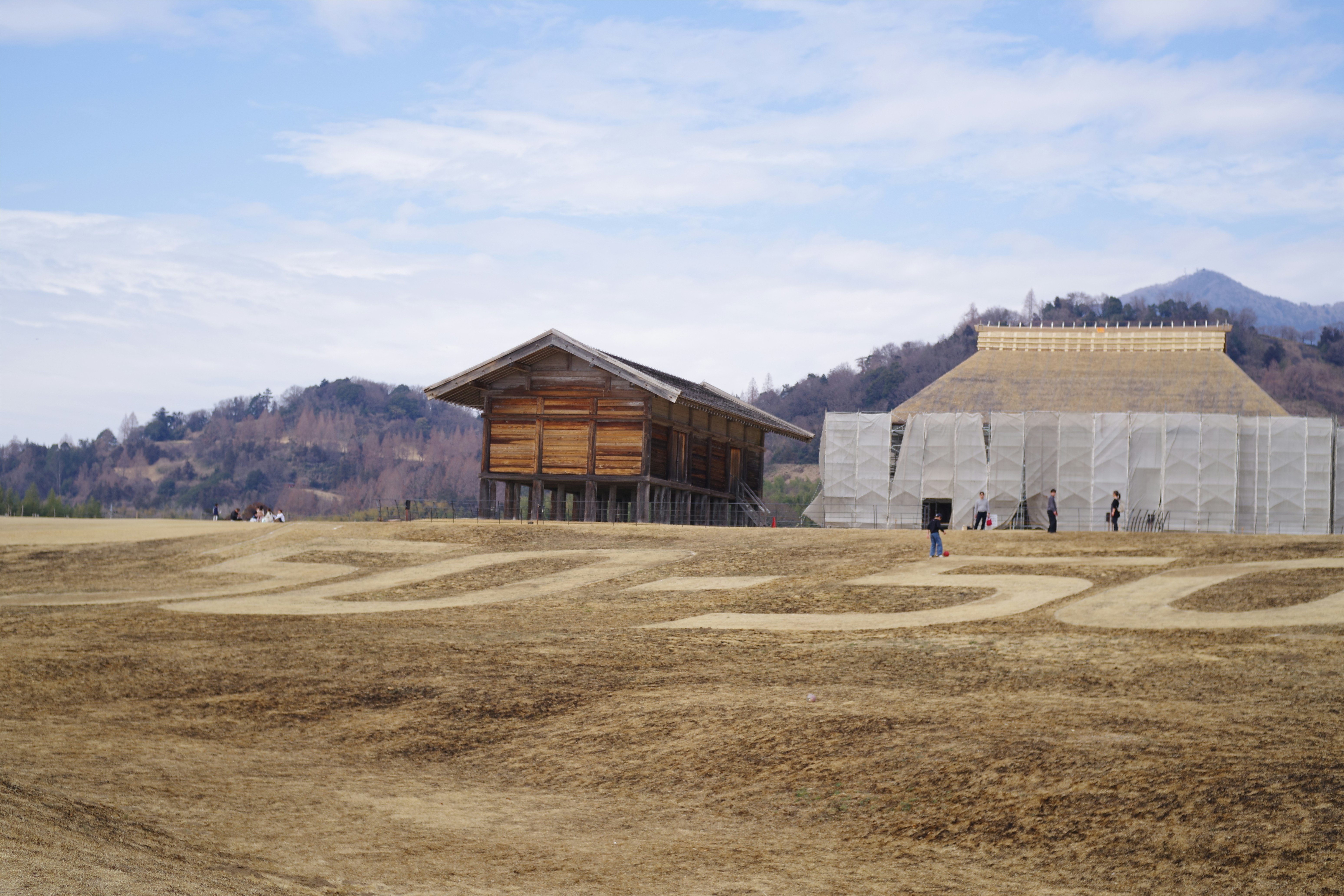 Ancient Pavilion and Terrace Under Wide Sky
