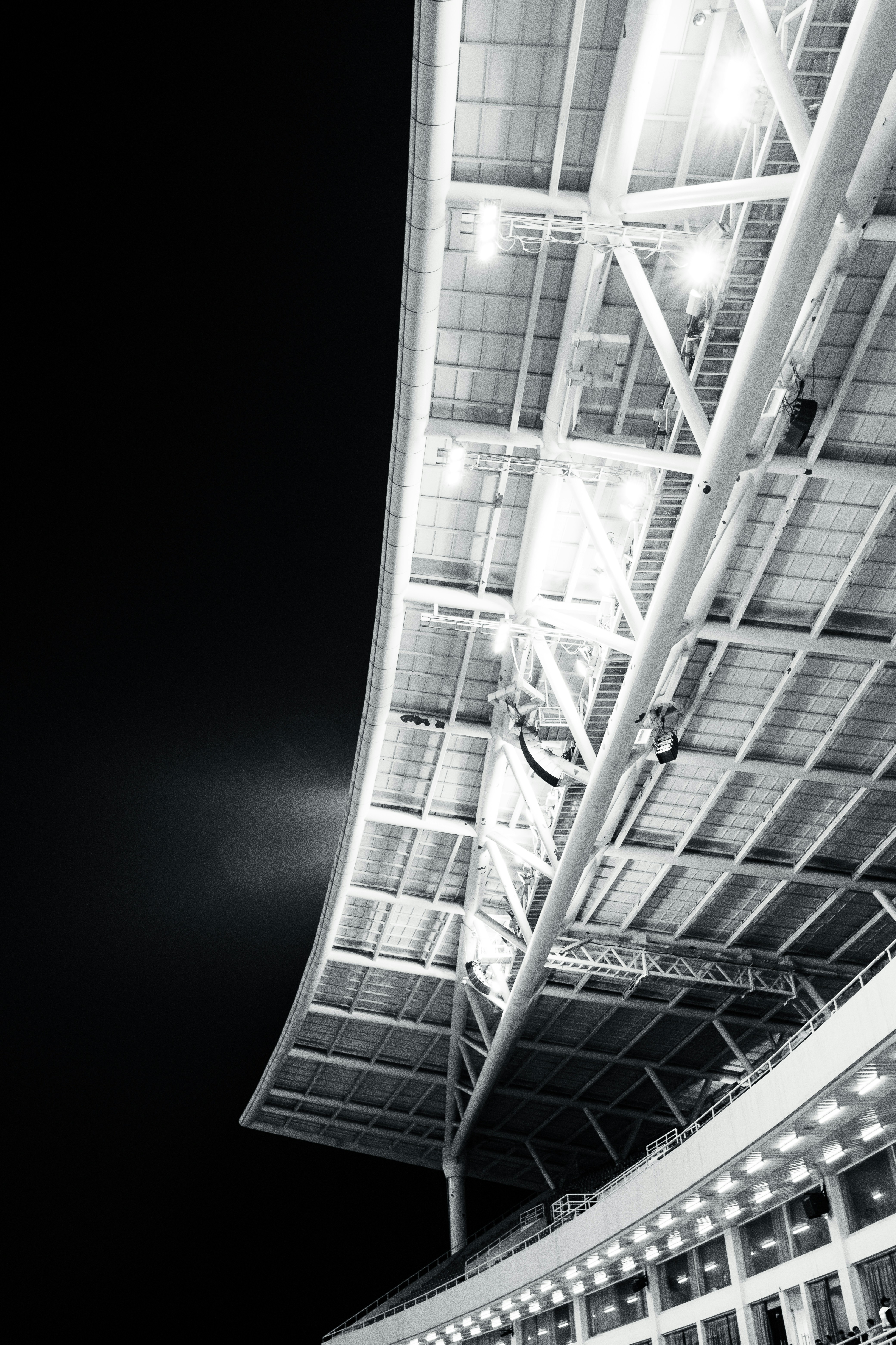 Arch of Light: Night Geometry Under the Stadium Canopy