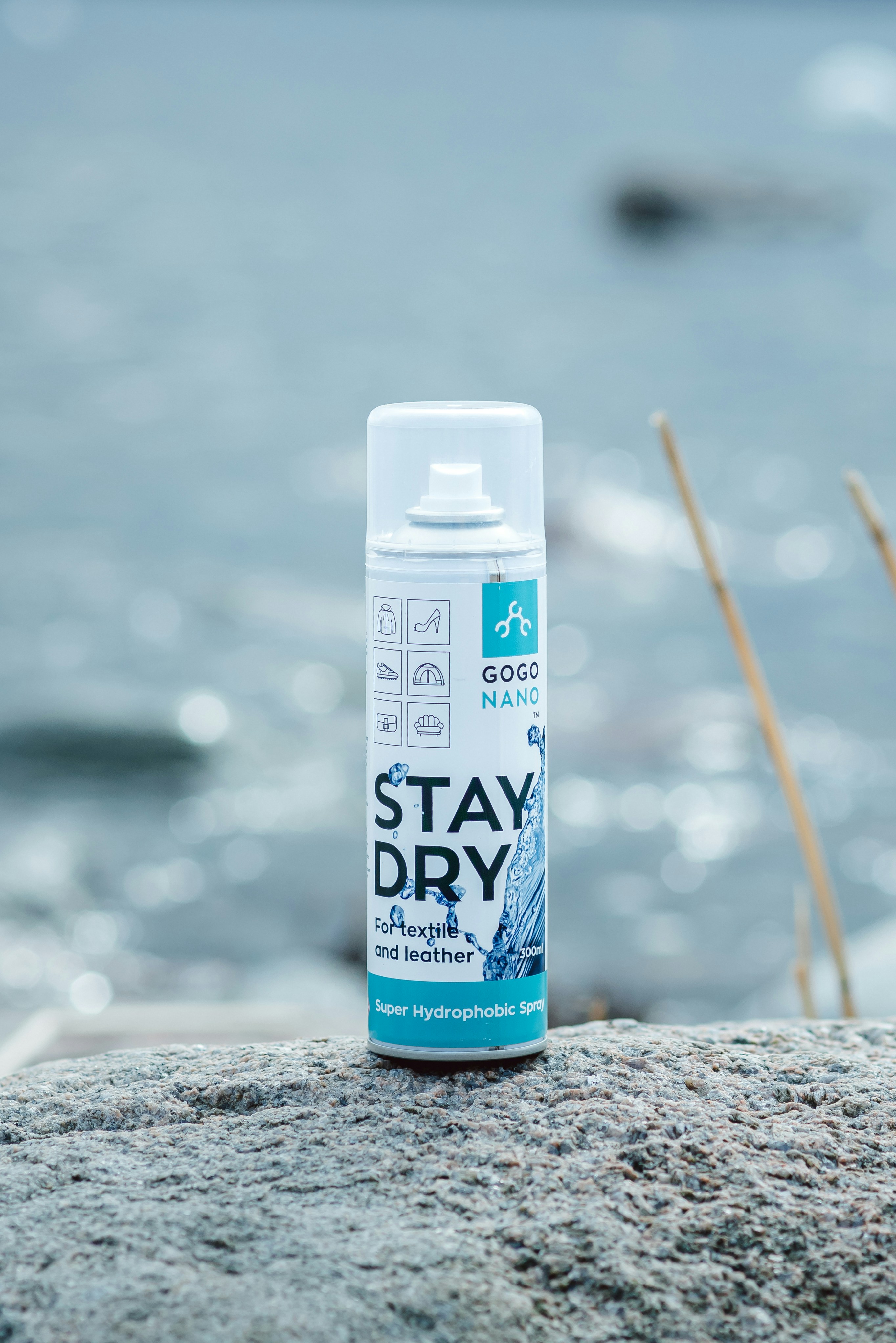 Minimal Product Portrait: Stay Dry Spray by a Quiet Lake