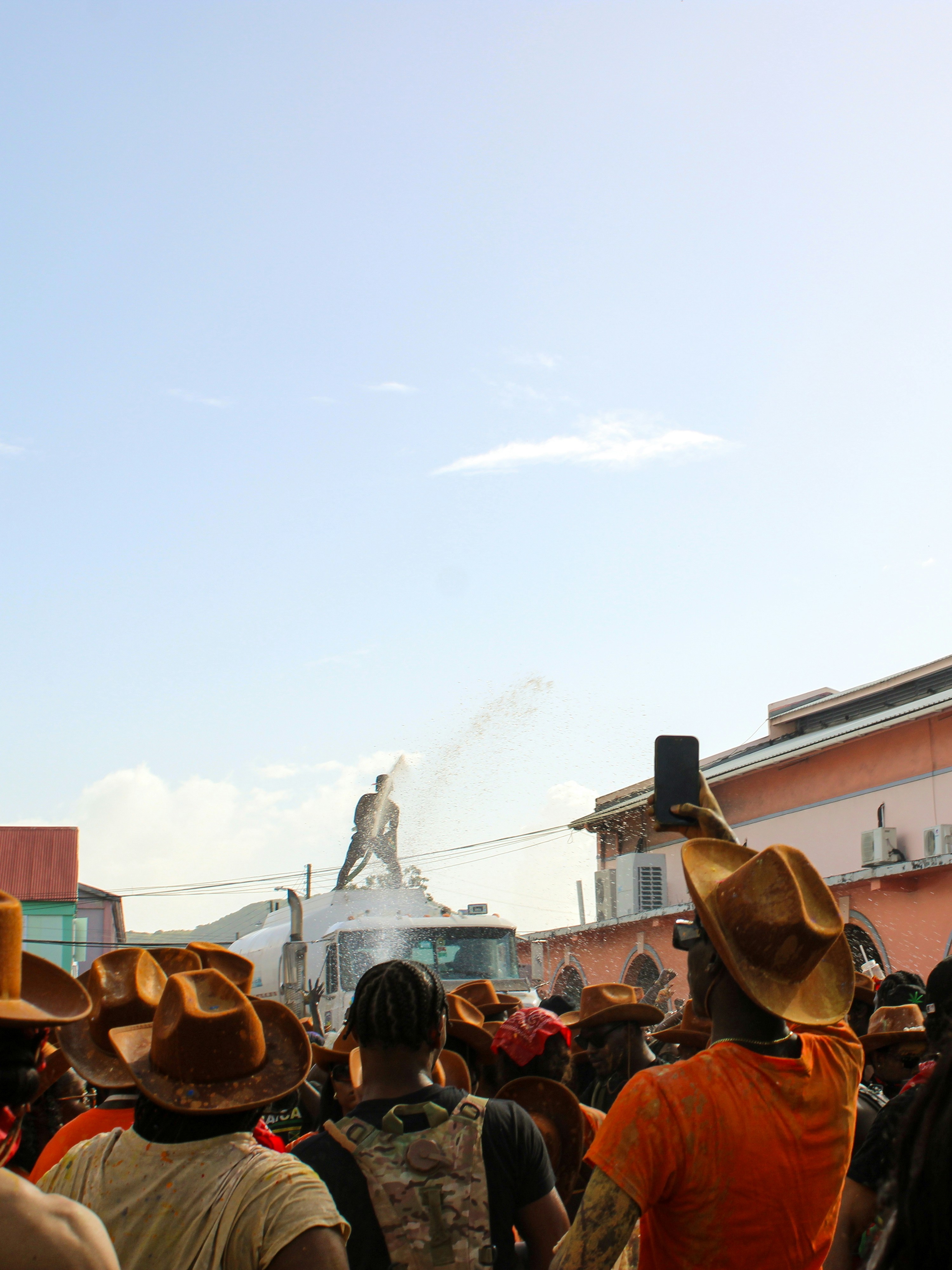 A crowd of people standing around each other