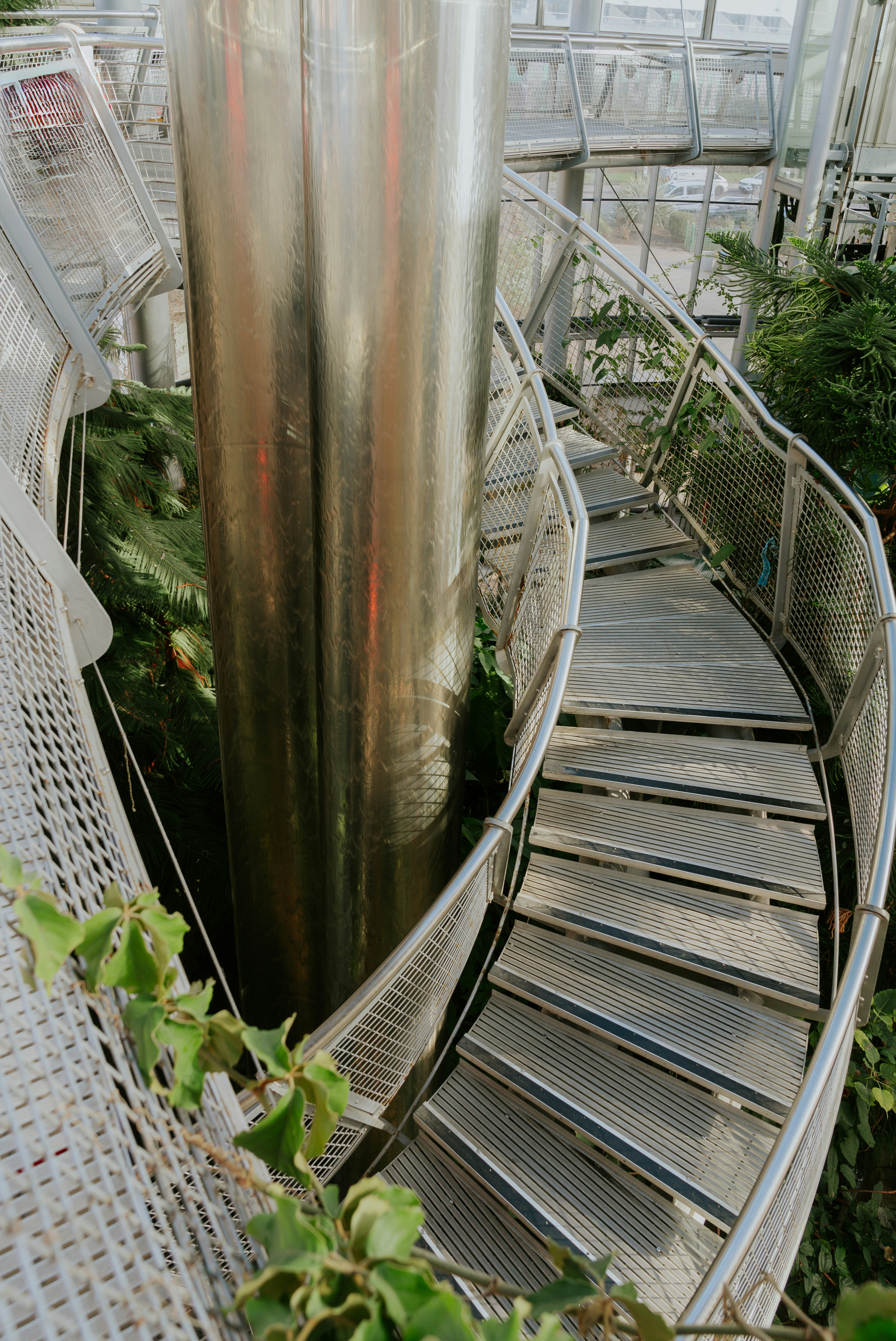 Spiral Metal Staircase Encircling a Monolithic Steel Column