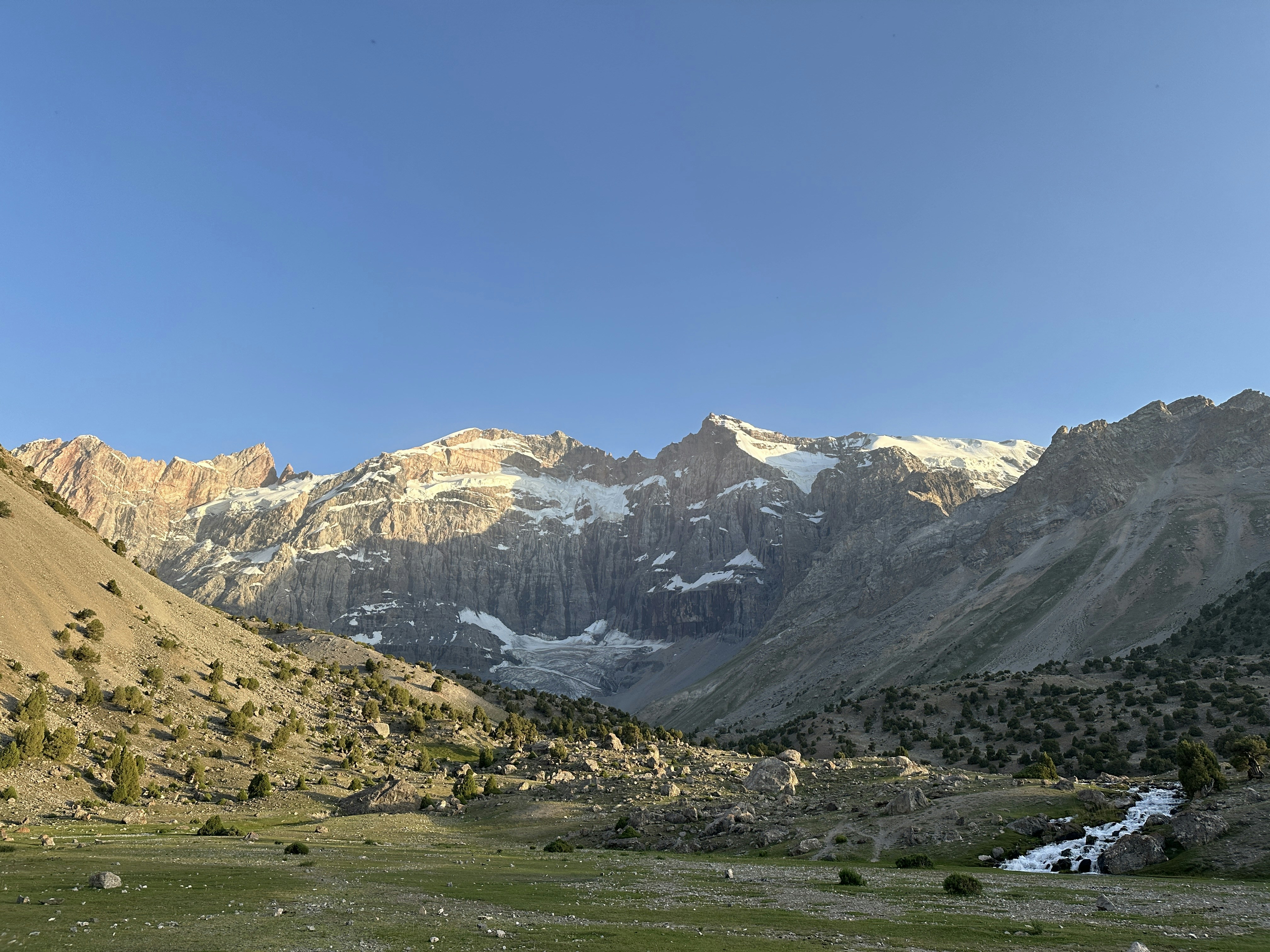 Sunlit Majesty of Snow-Capped Peaks