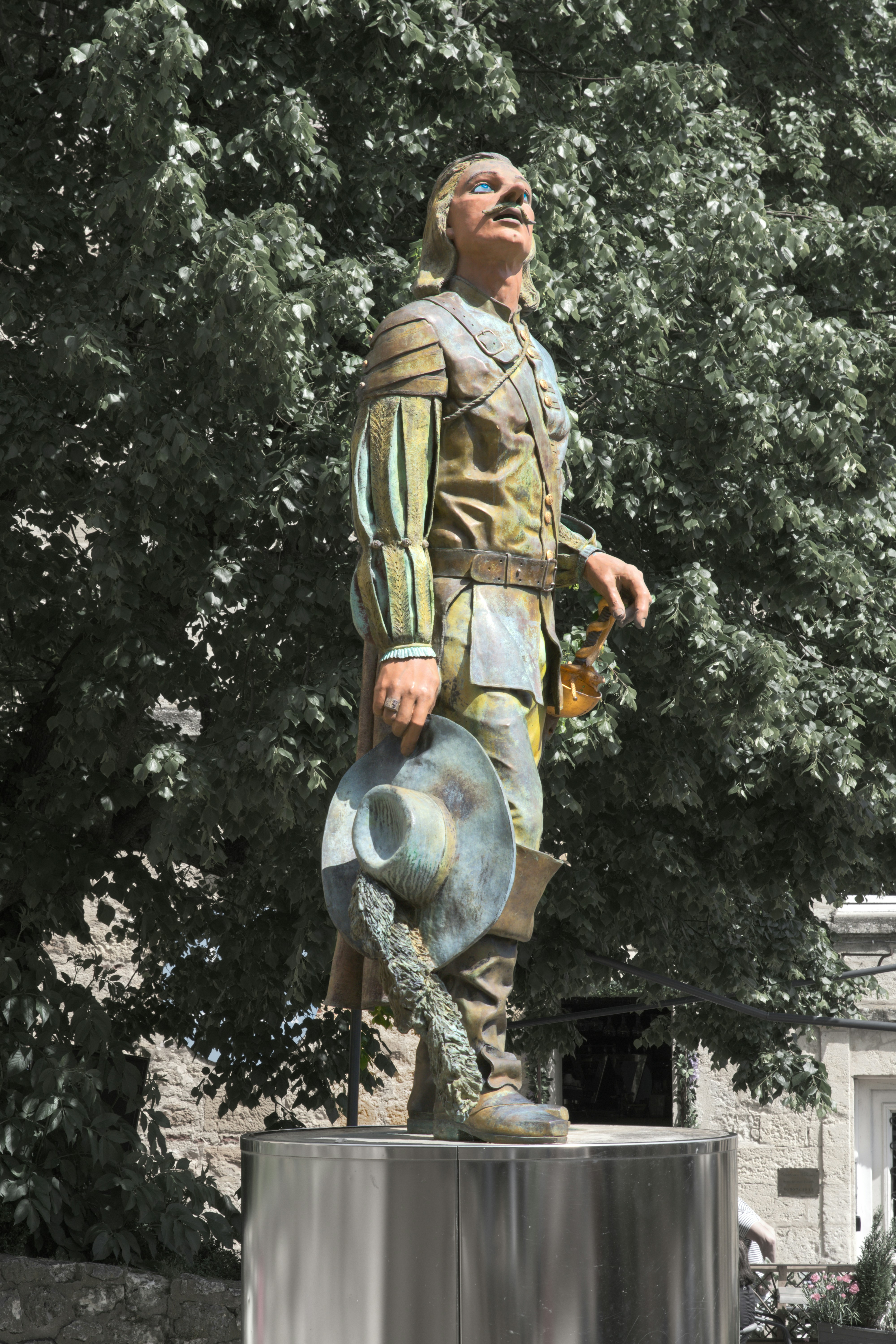 Bronze Sentinel in the Park: A Soldier's Stance Beneath Dappled Shadows