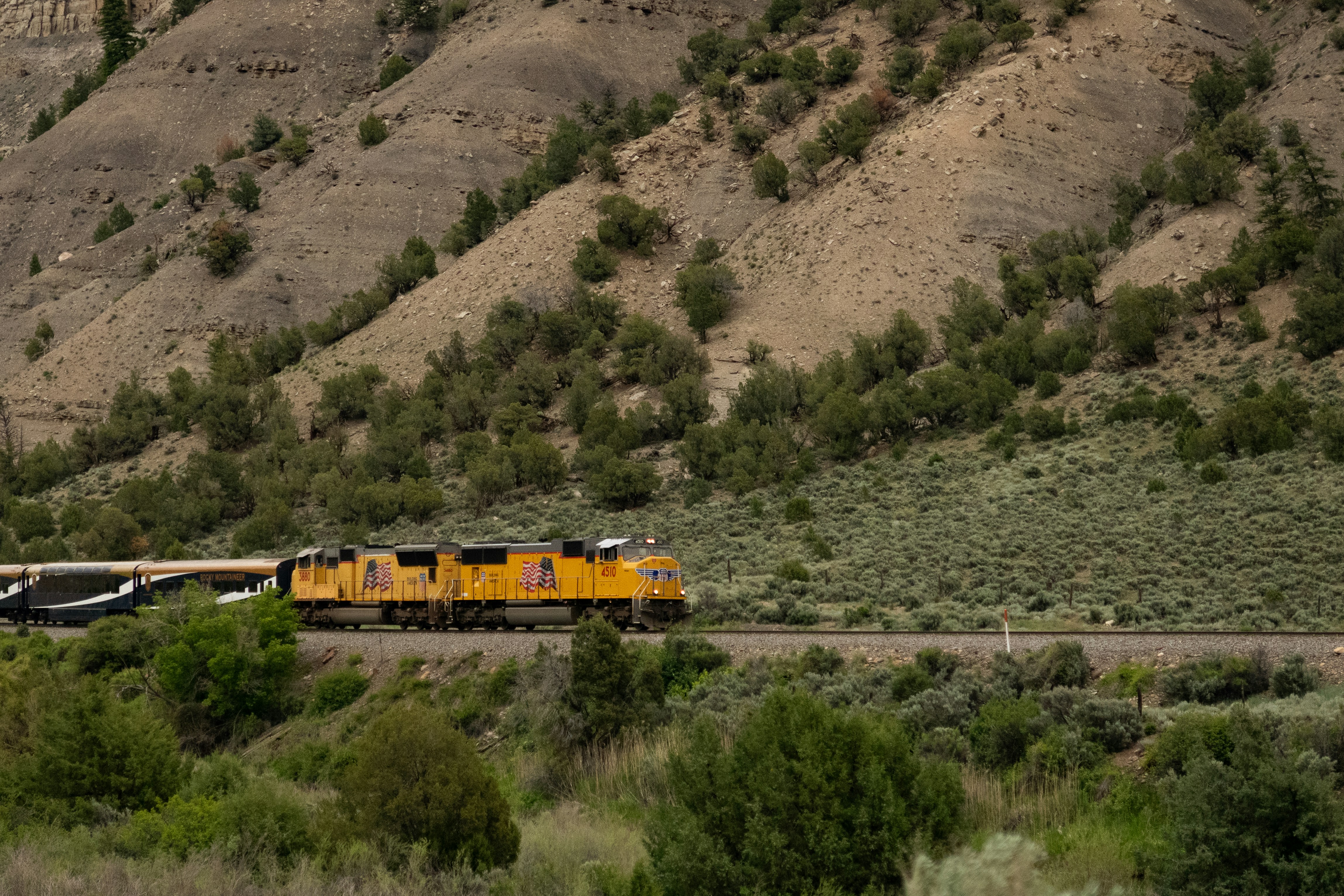 This train passed by while stopped on the side of the road. It was driving beside the Colorado River.