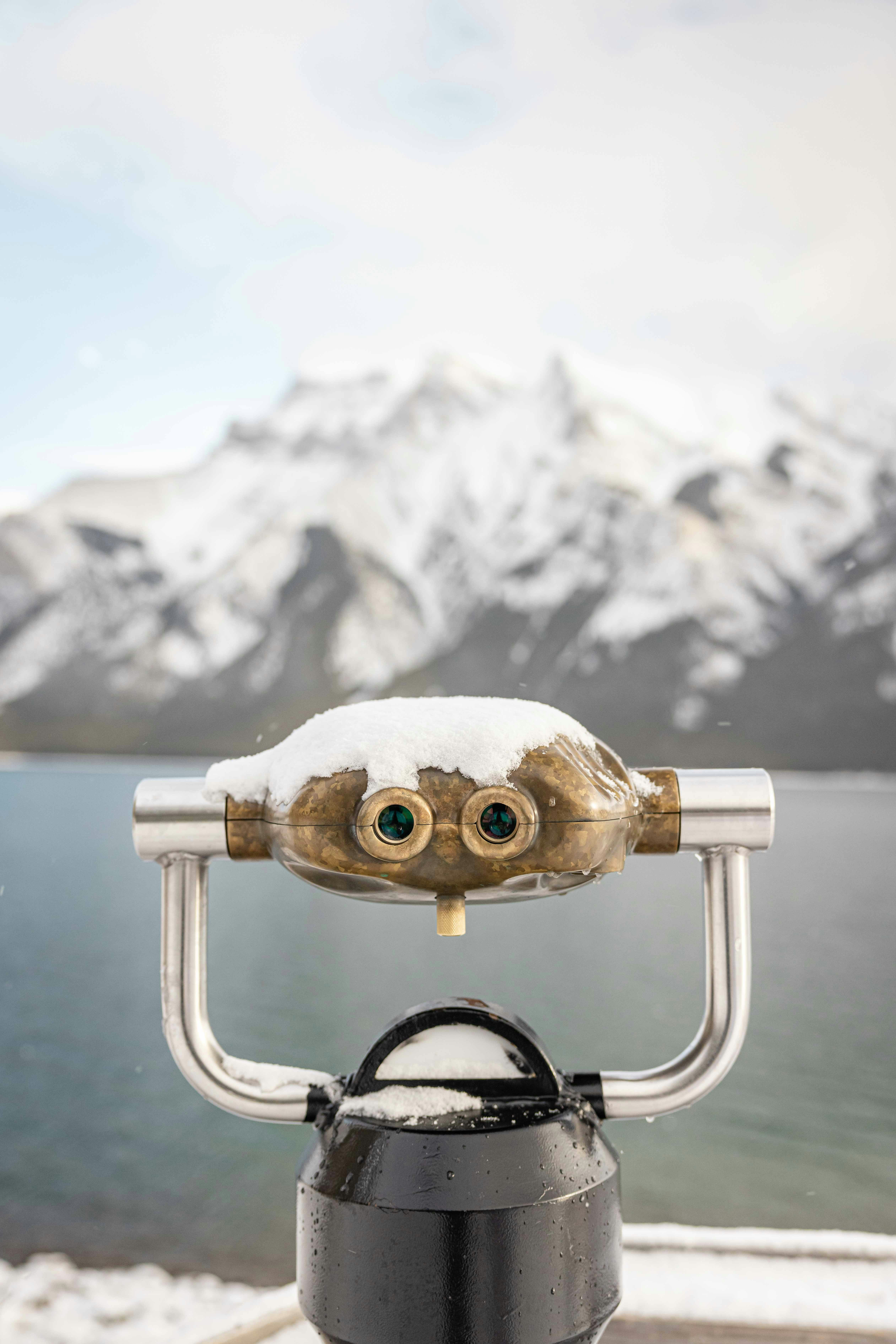 Snowbound Gazer: A Public Telescope Pier Over an Alpine Lake