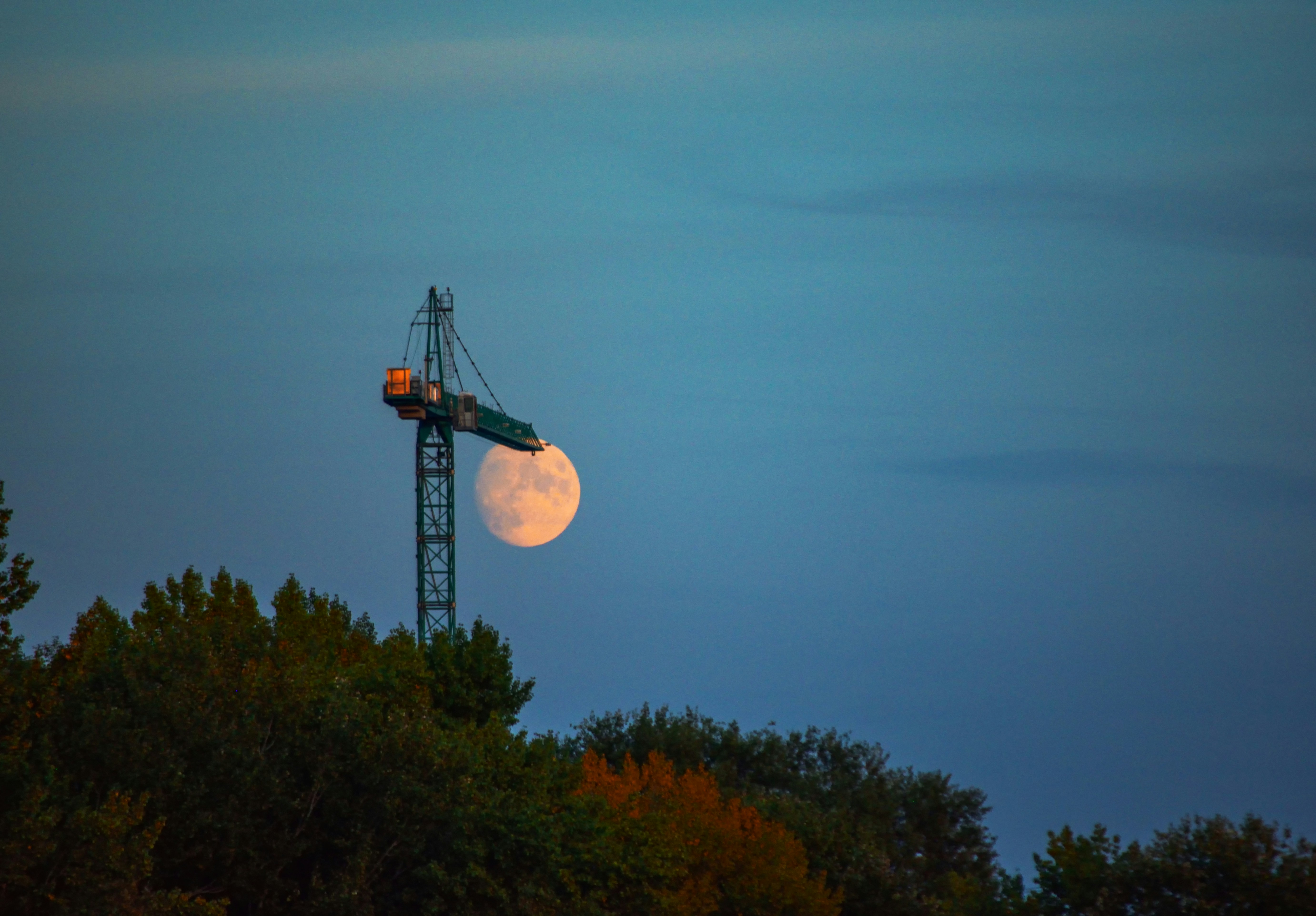 A crane with a full moon in the background photo – Free Construction ...