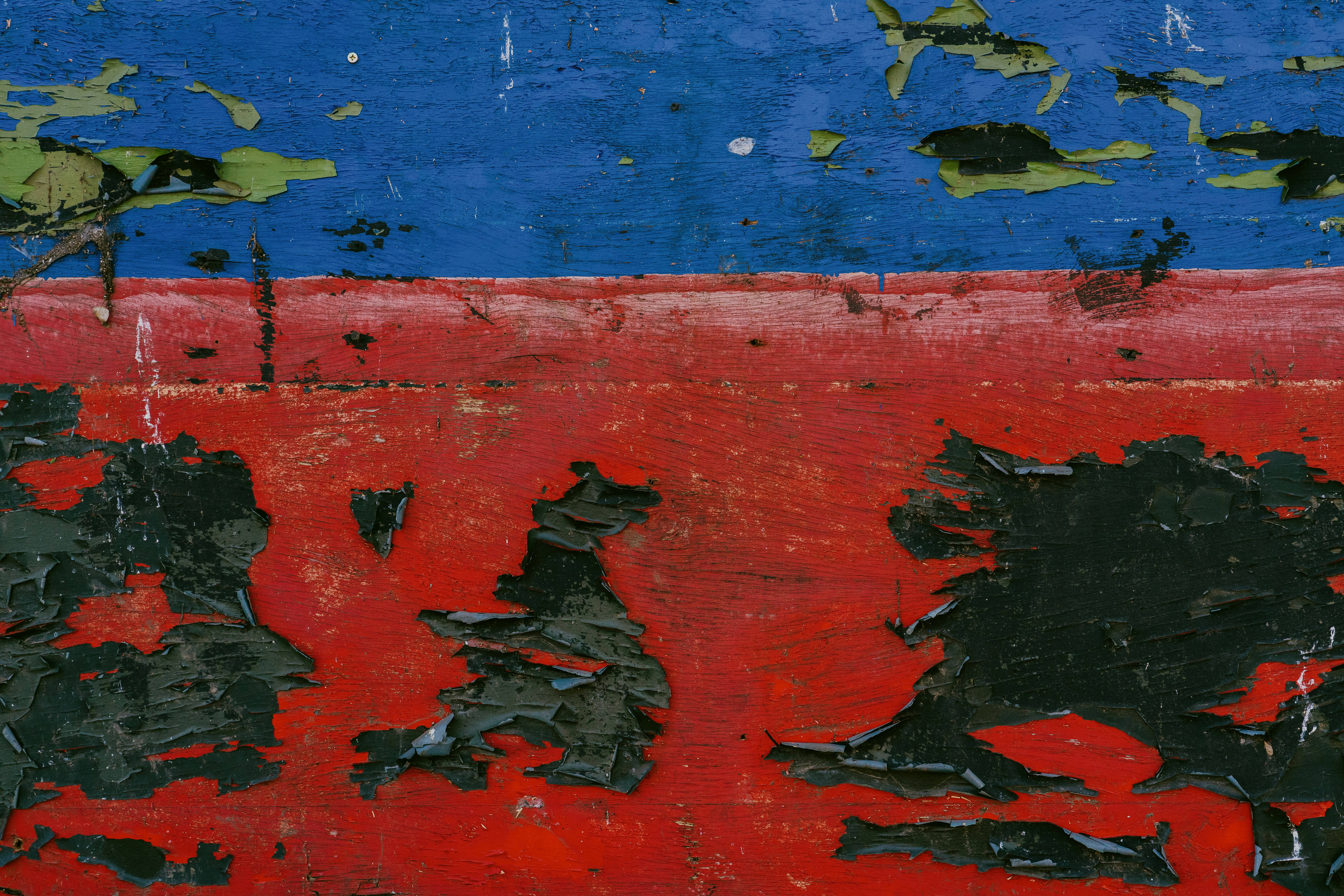 Peel of Color: Blue Sky over Weathered Red and Black