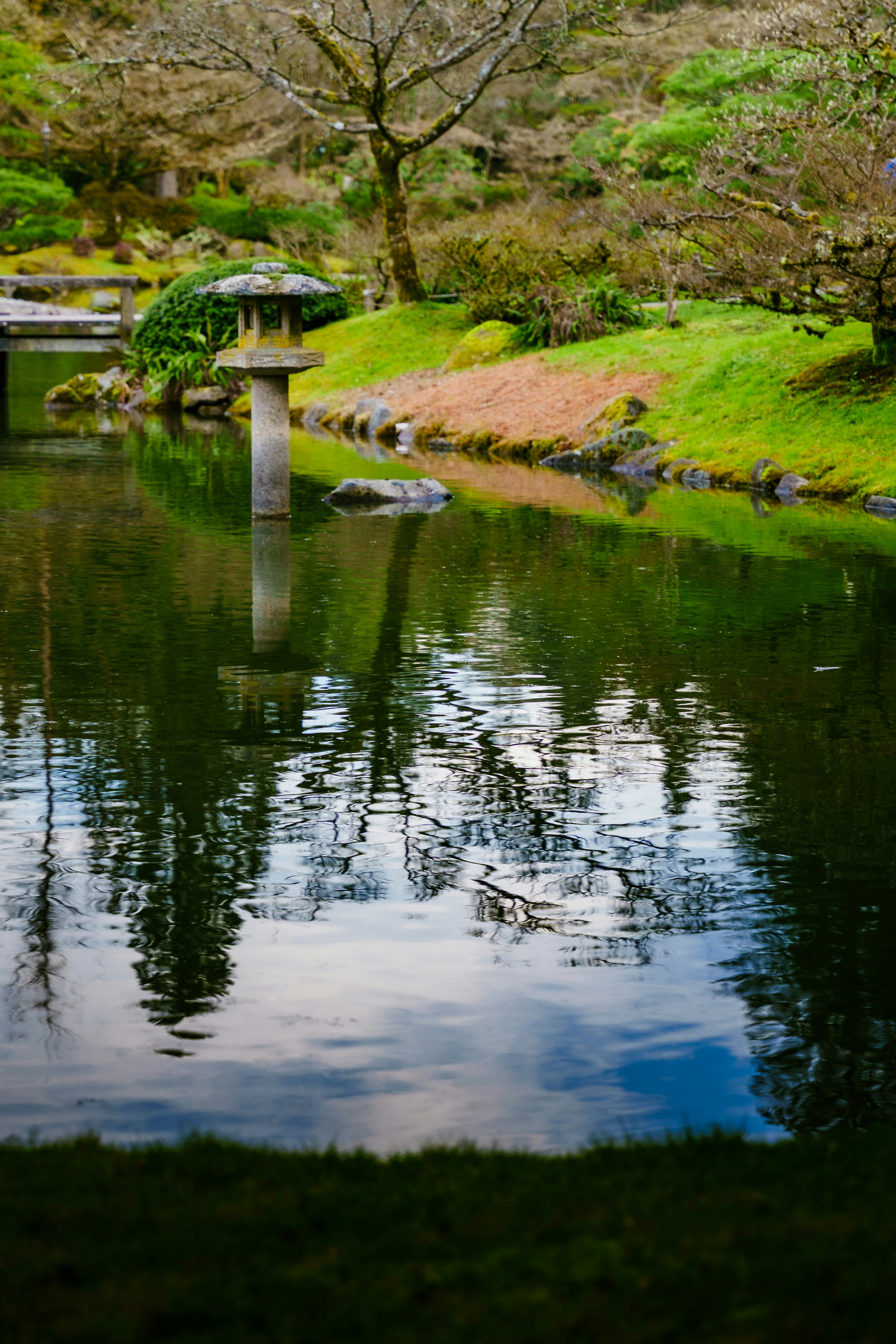 A tranquil japanese garden reflects in calm water. photo – Free Flower ...