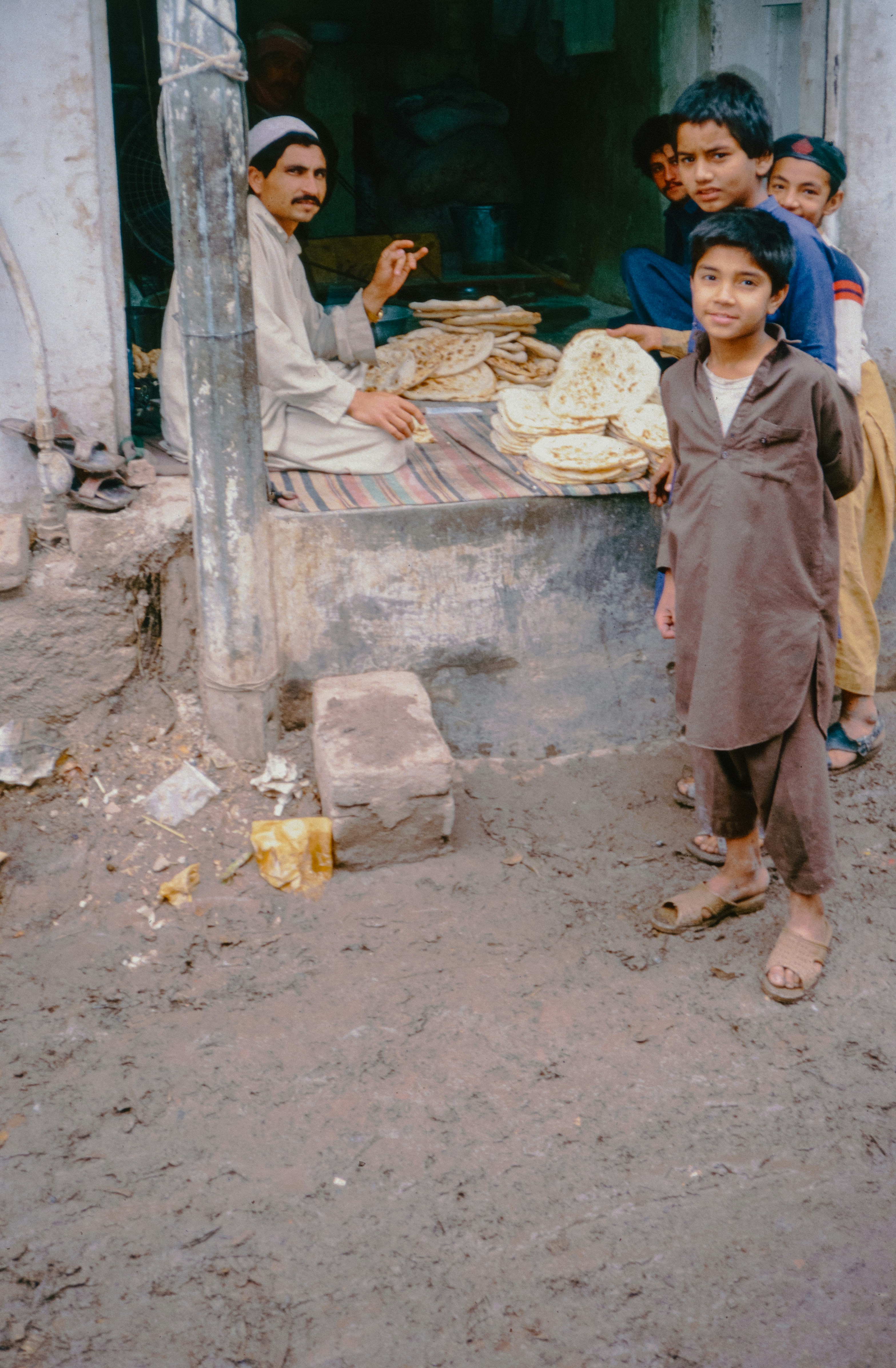 A group of people standing outside of a building photo – Free People ...