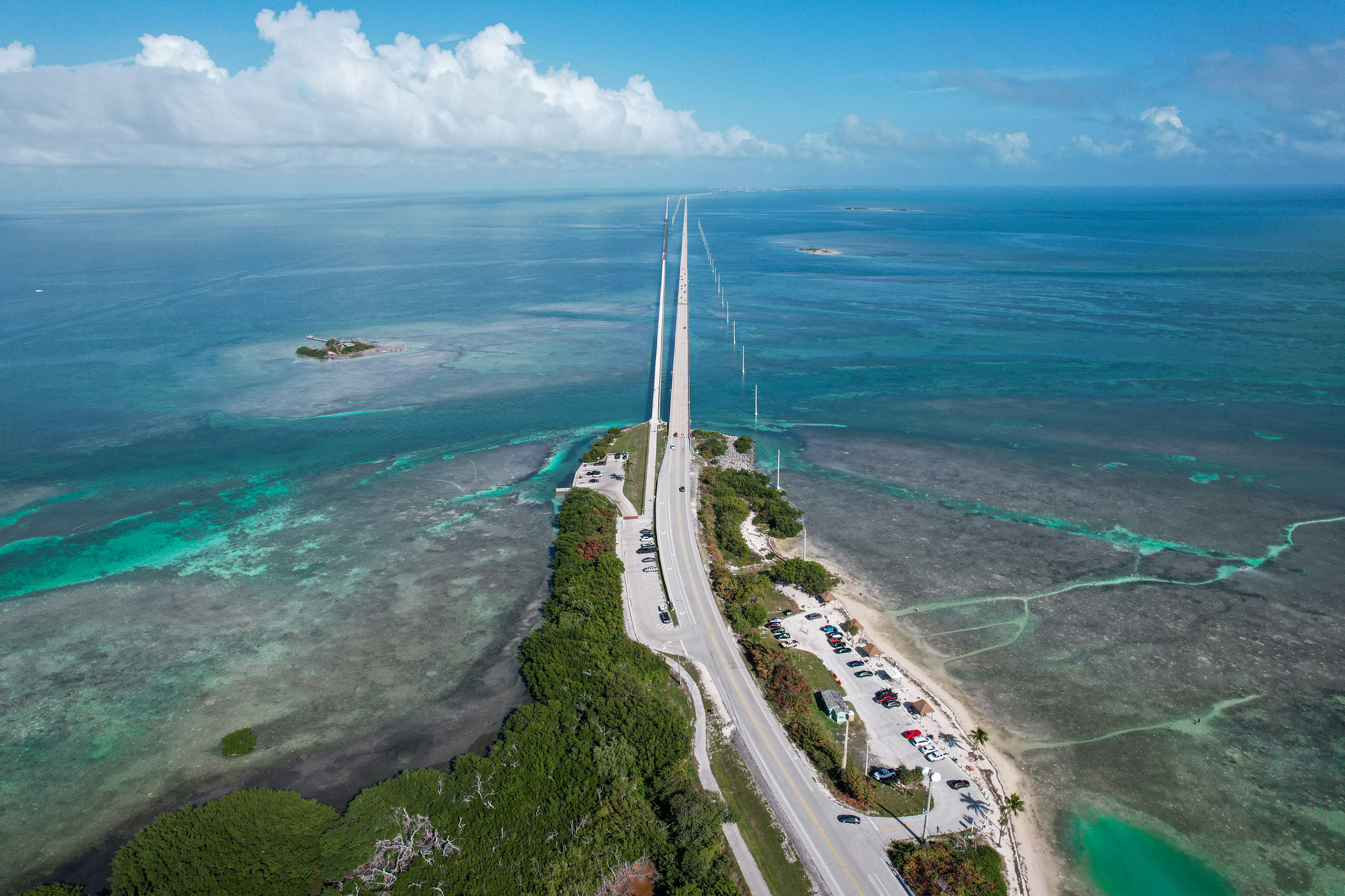 Aerial view of the Seven Mile Bridge stretching across the vibrant turquoise waters of the Florida Keys.