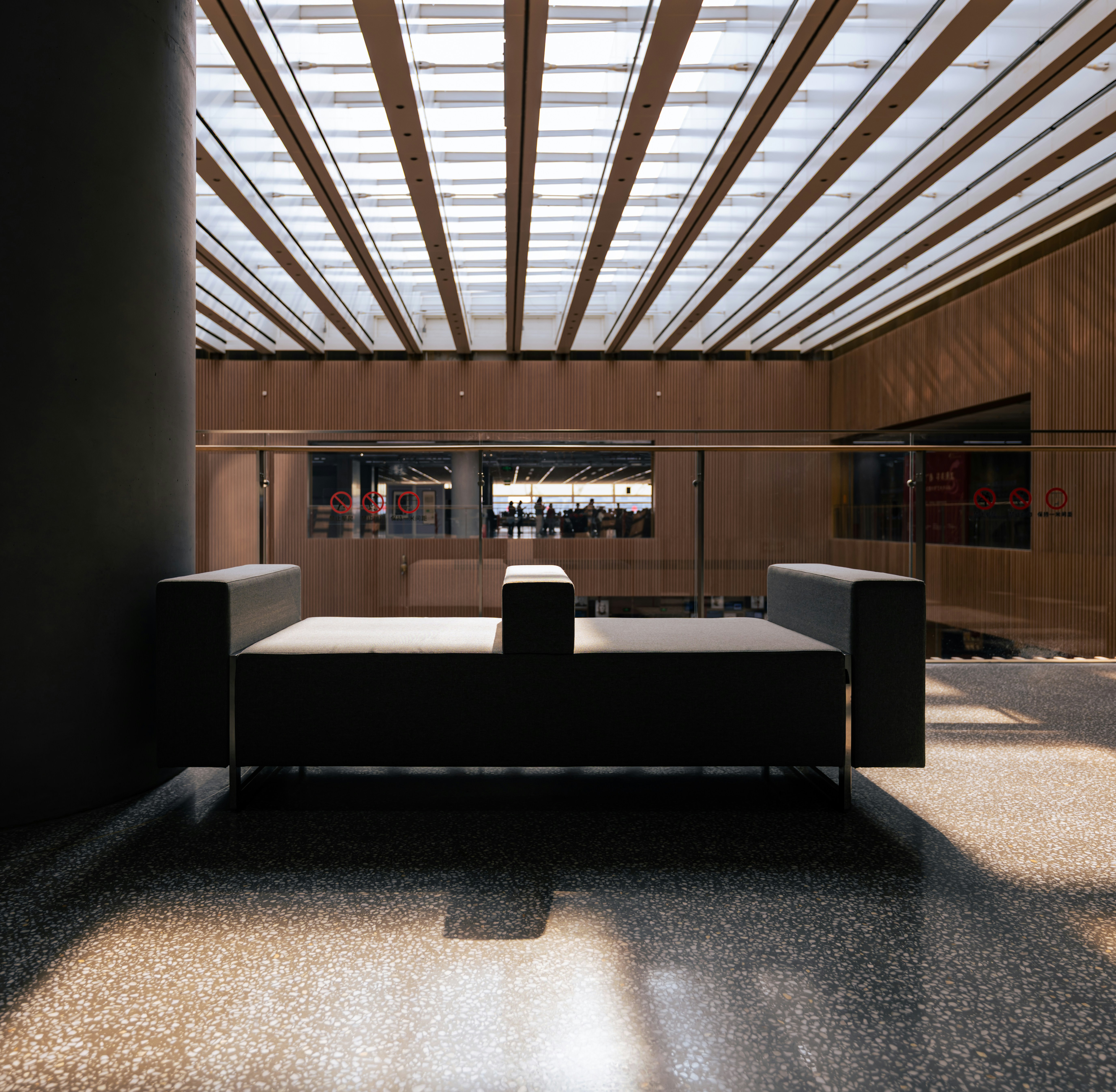 The Quiet Atrium: Sunlit Geometry and a Central Lounge