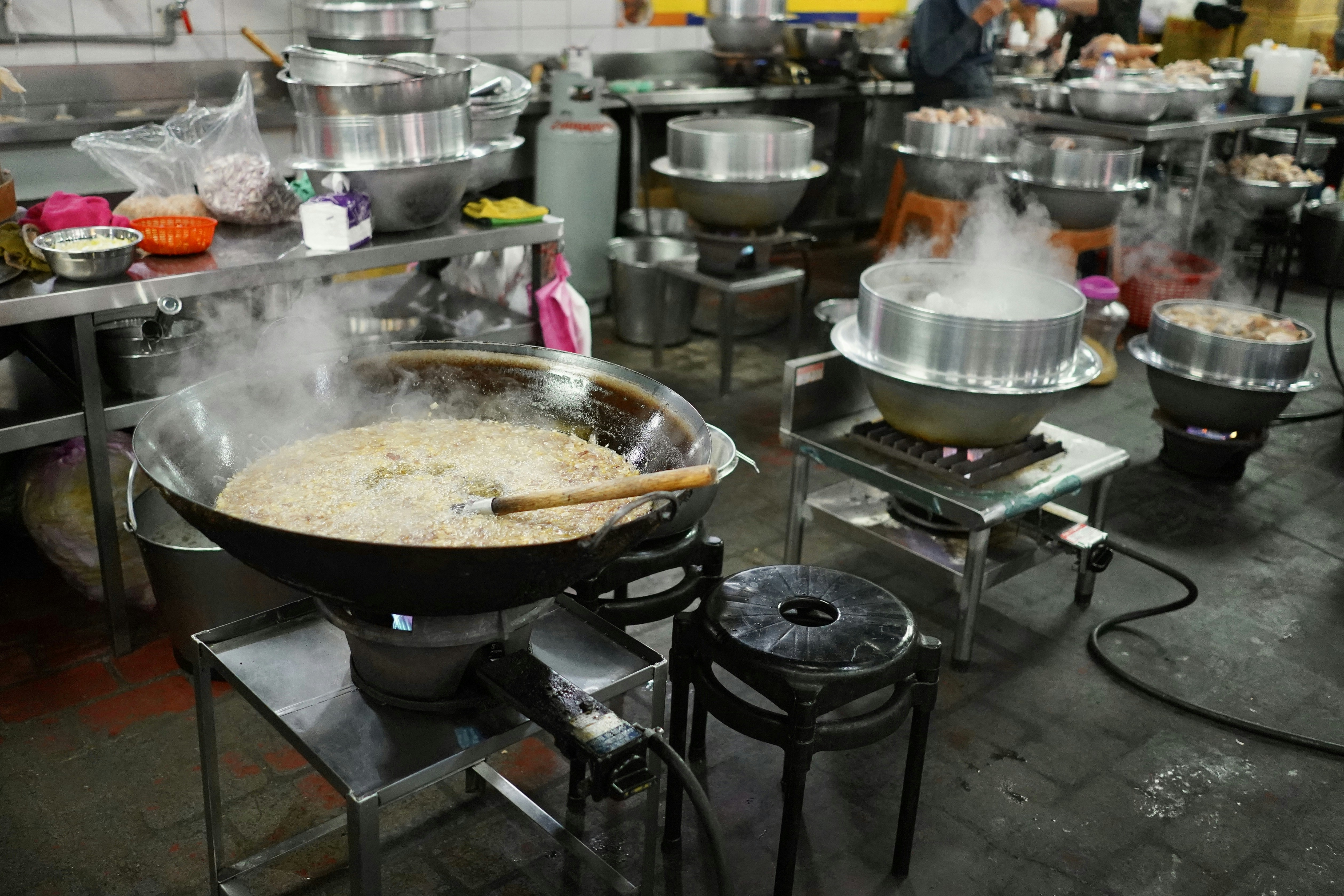 A busy kitchen with food cooking and steaming. photo – Free Cooking ...