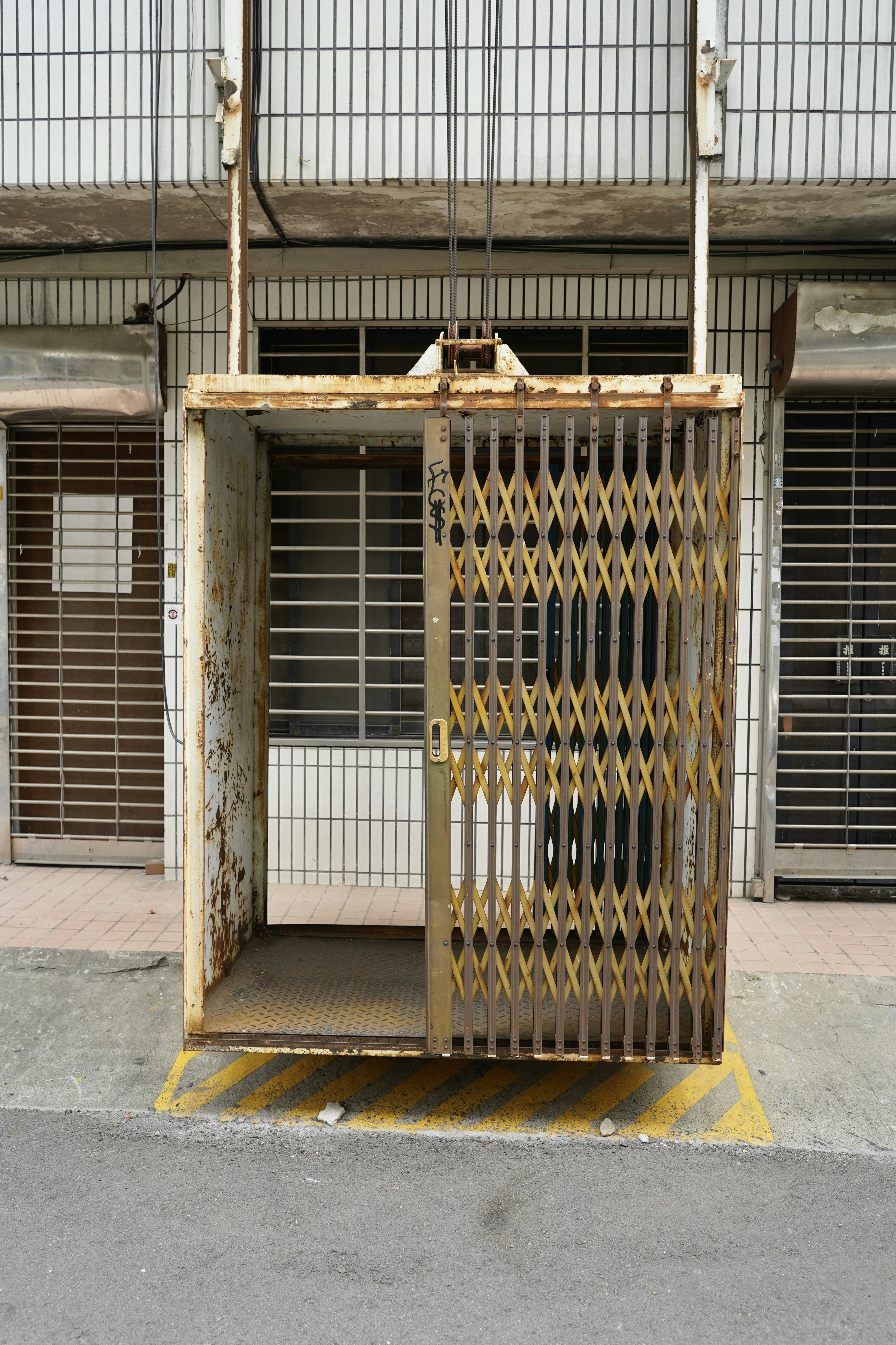 An old, rusty elevator is pictured here. photo – Free Building Image on ...