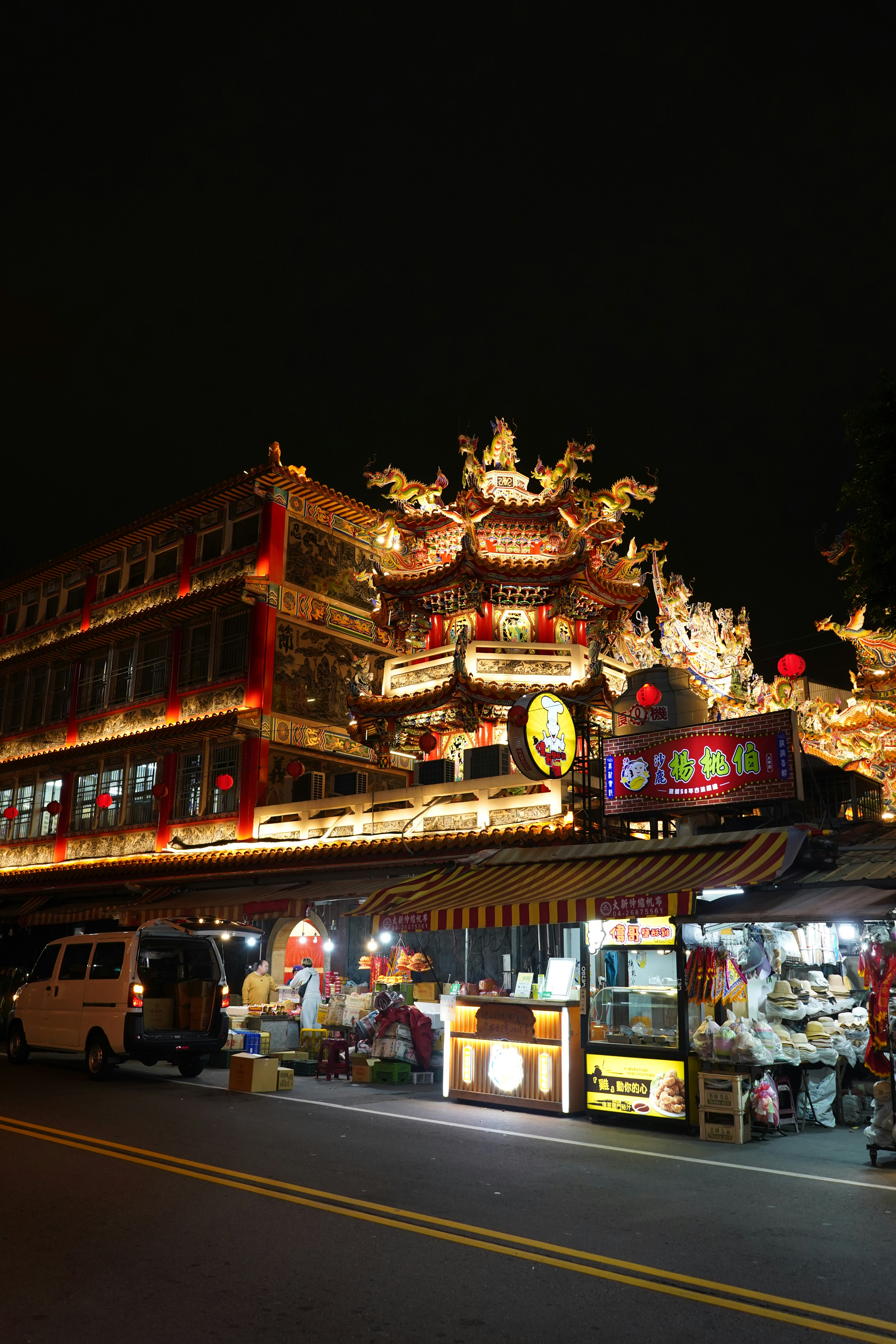 Shrine behind night market stalls
