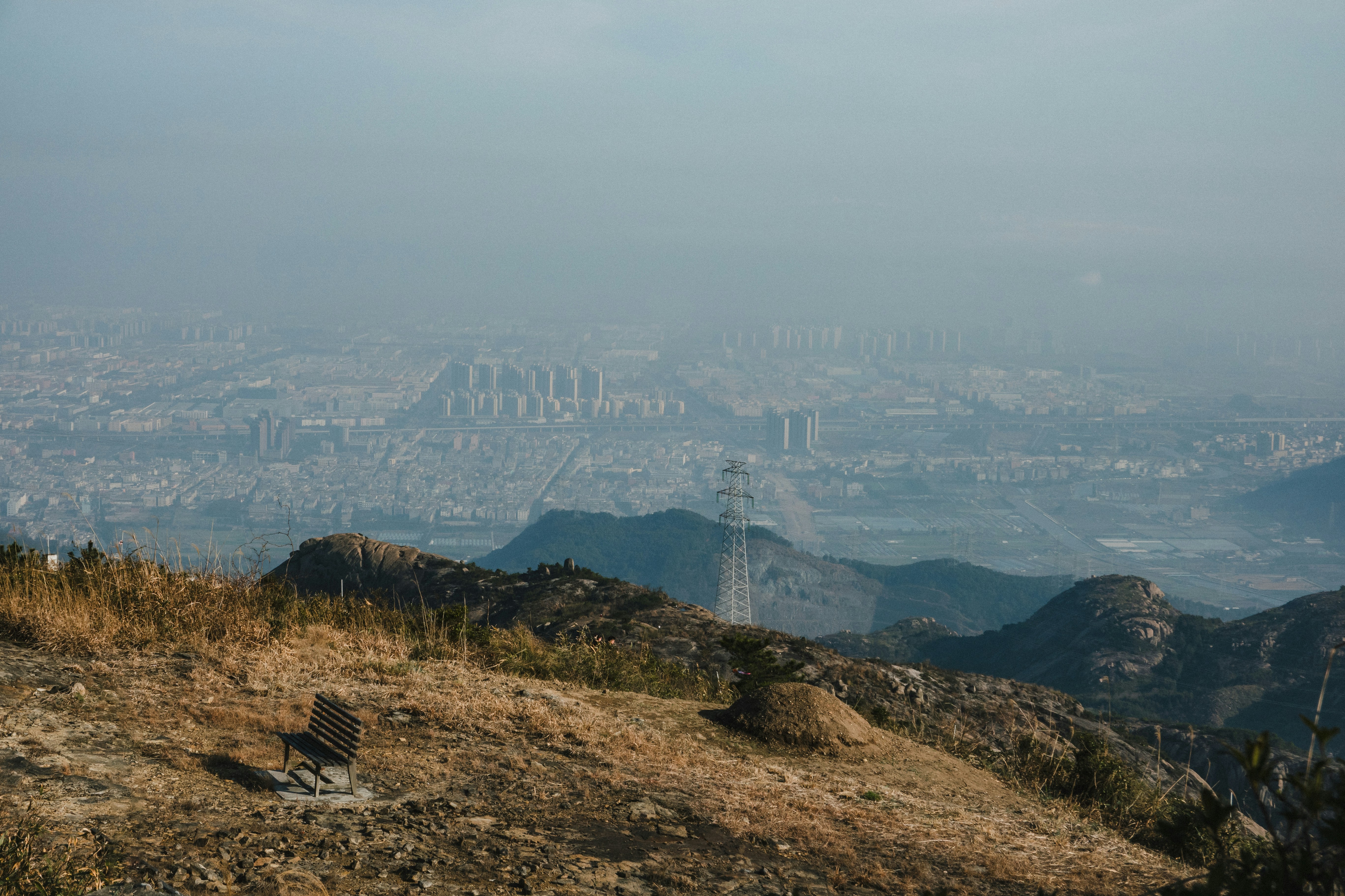 Solitary Bench Overlooking Urban Haze