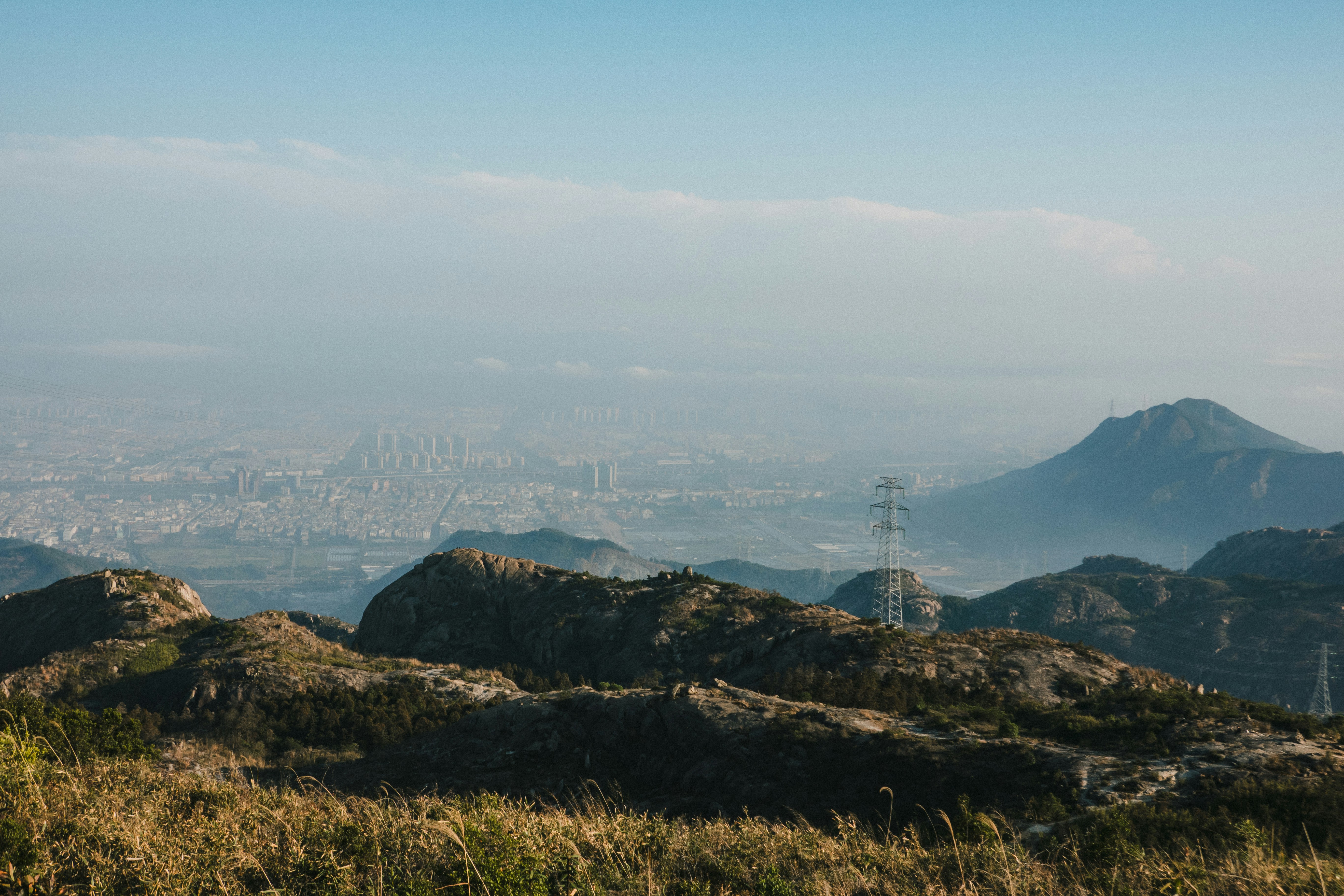 Urban Horizon Meets Rugged Peaks