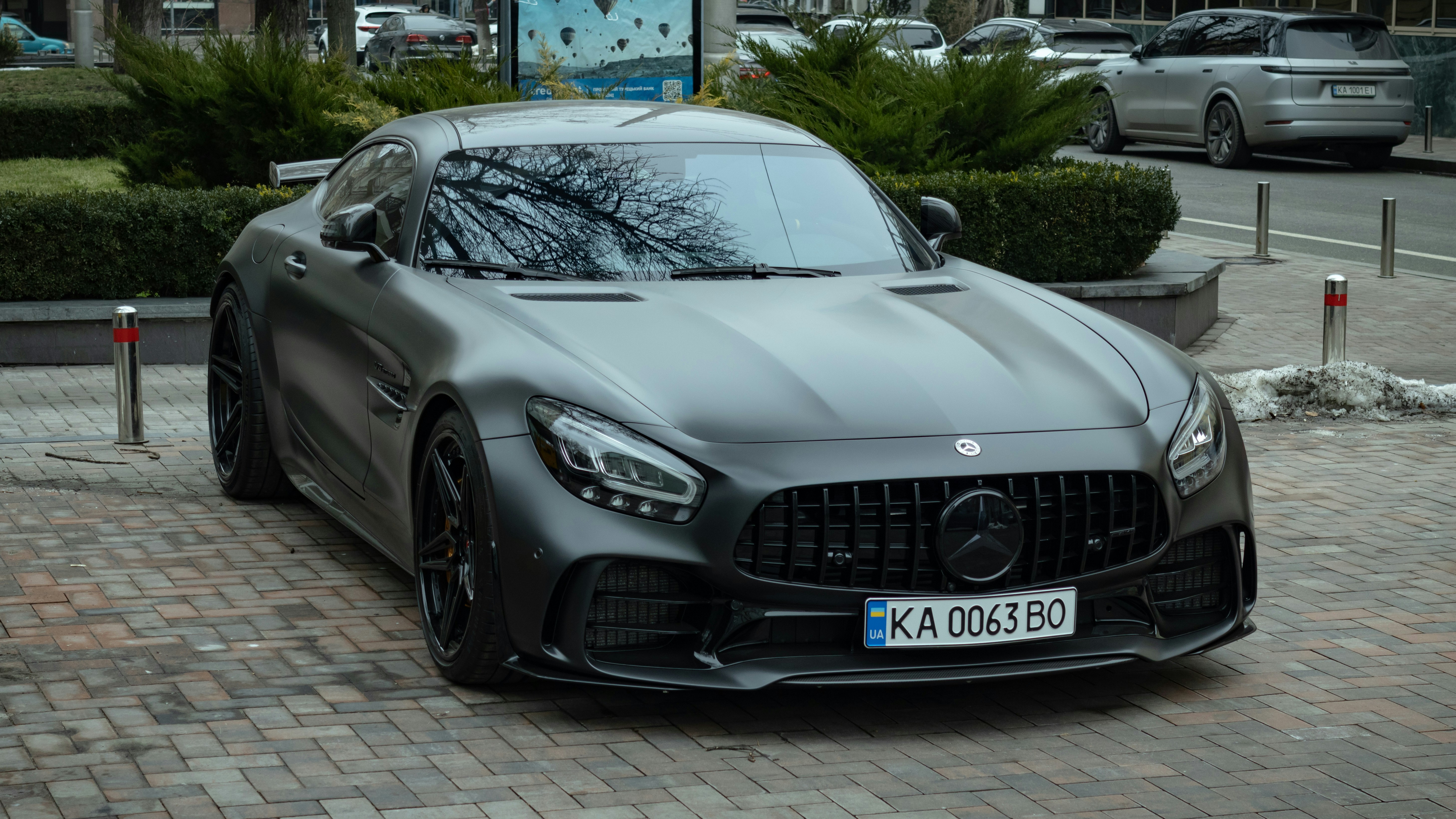 A matte grey mercedes-amg gt is parked on the street. photo – Free Car ...