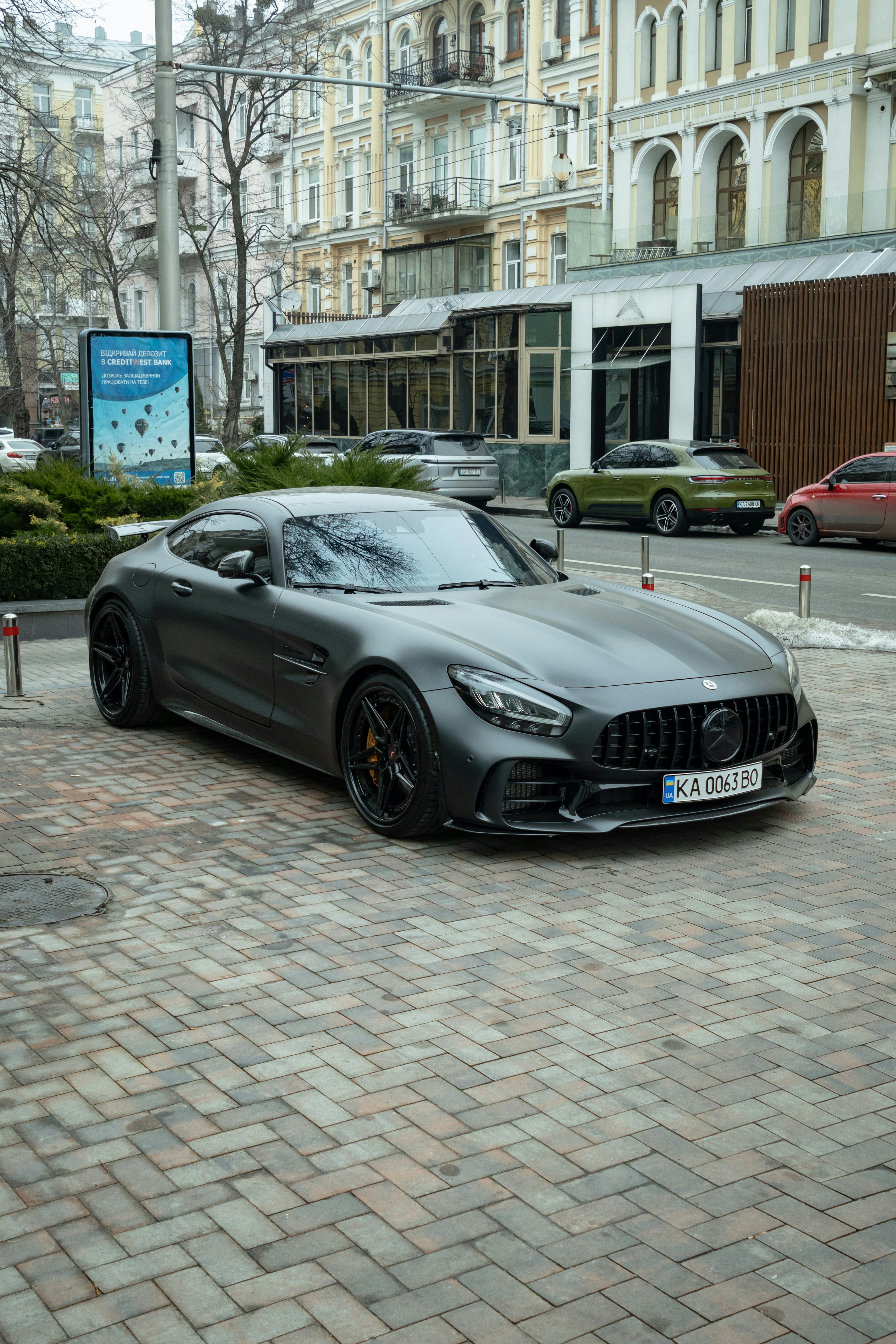 Matte Mercedes AMG GT Commands the Cobblestone Street of a Historic City