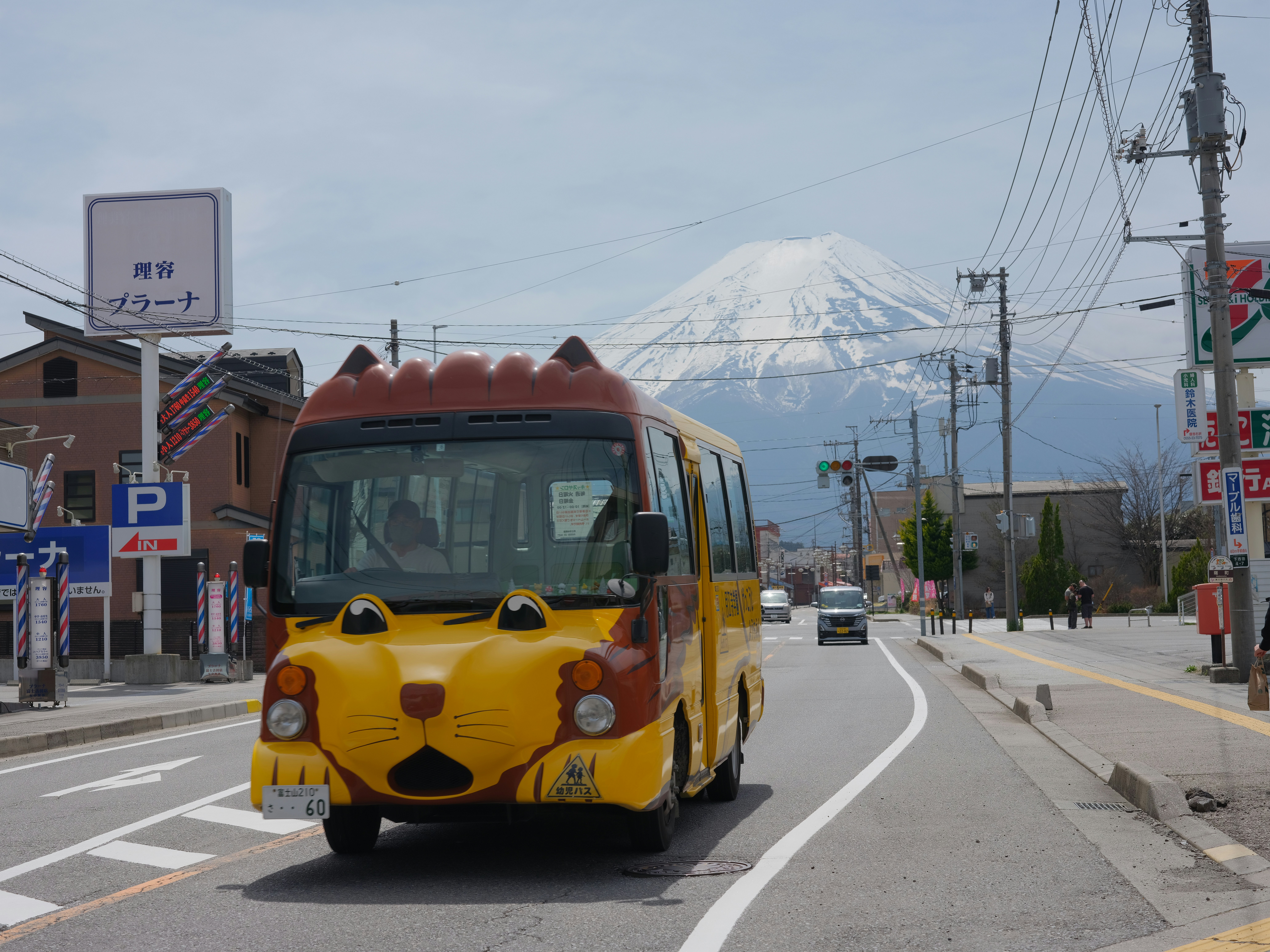 A Playful Bus Streaks Toward Mt. Fuji